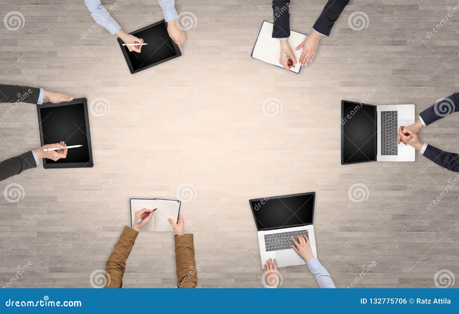 Group of People with Devices in Hands Having Desk Discussion and ...