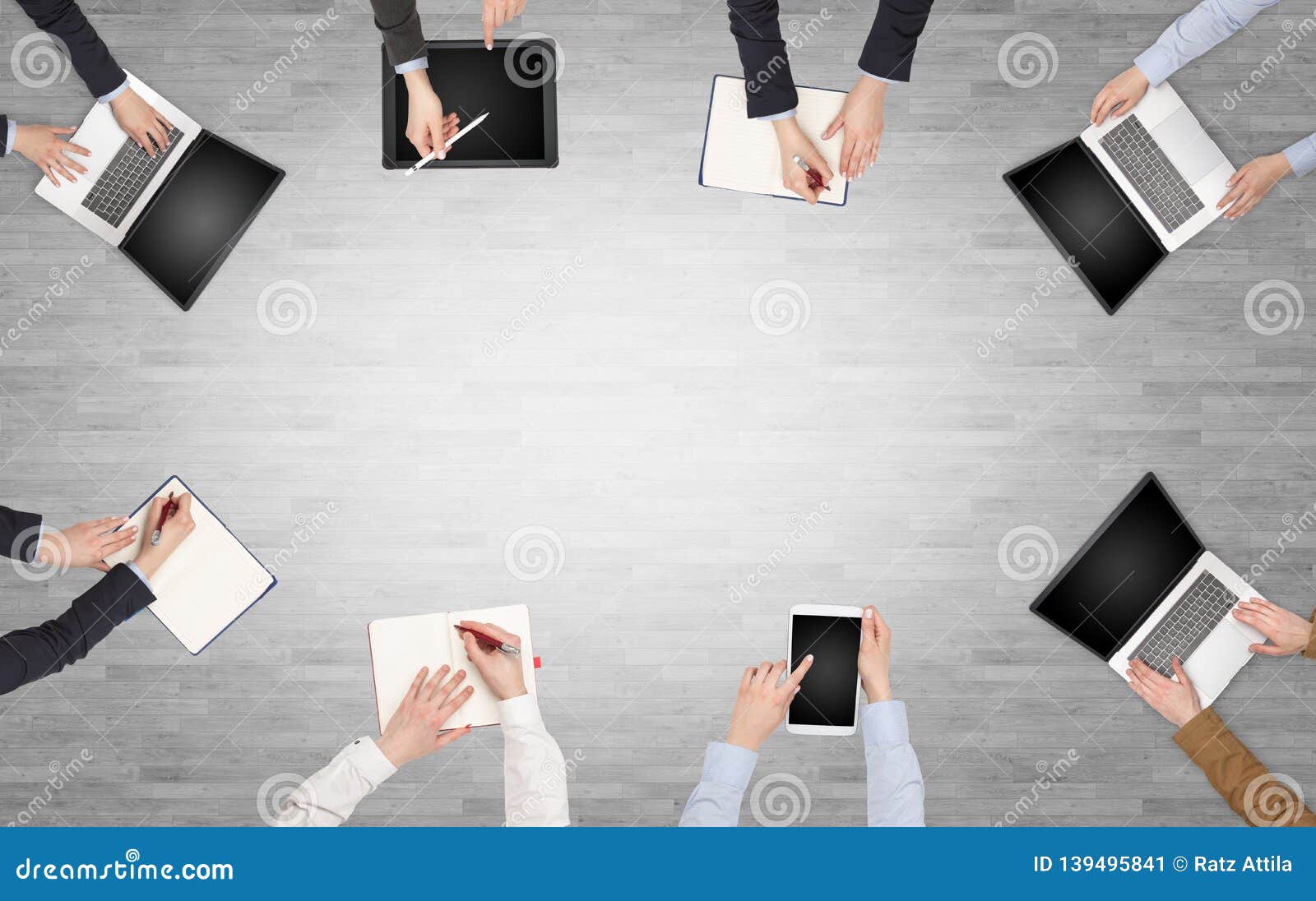Group of People with Devices in Hands Having Desk Discussion and ...