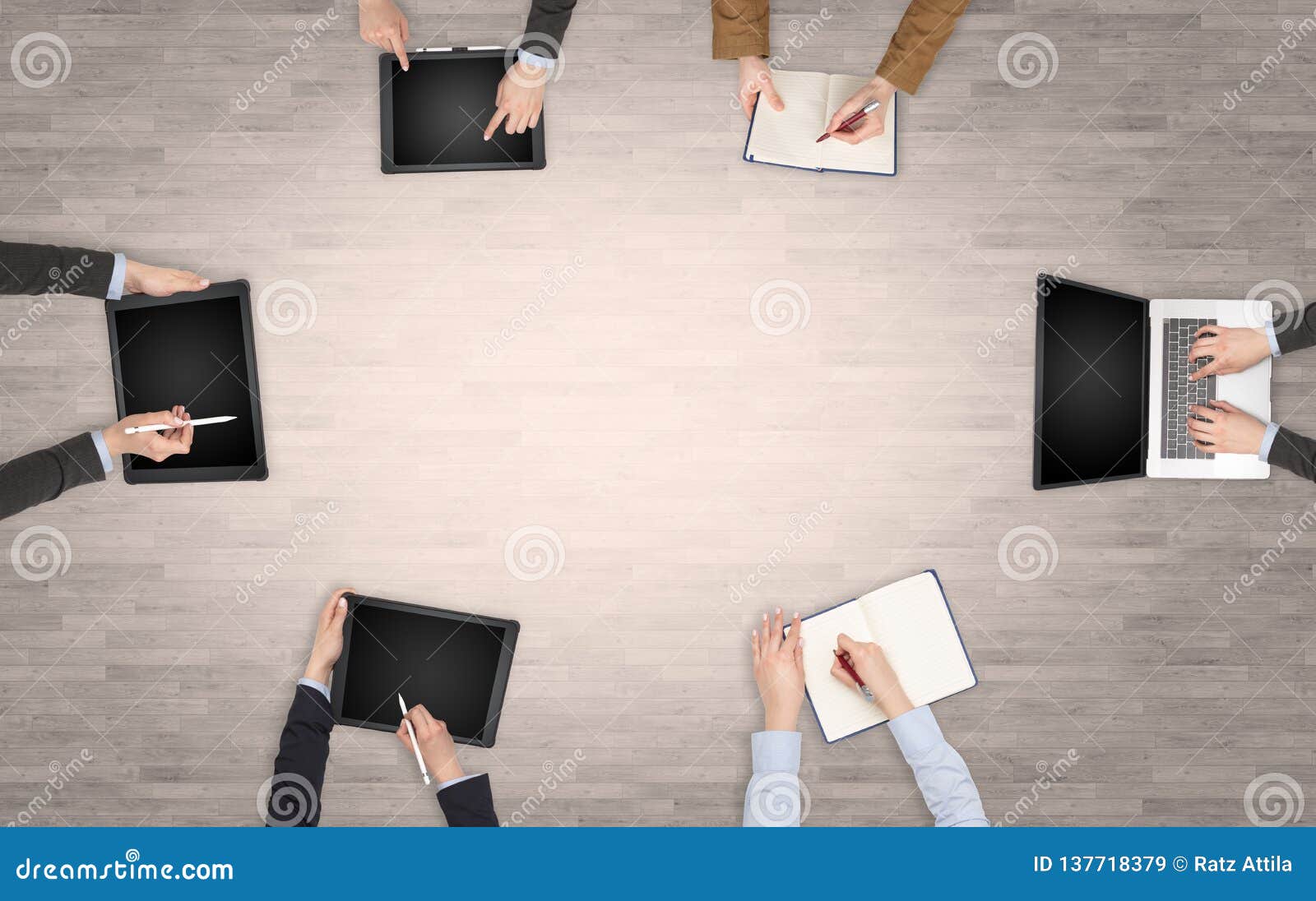Group of People with Devices in Hands Having Desk Discussion and ...