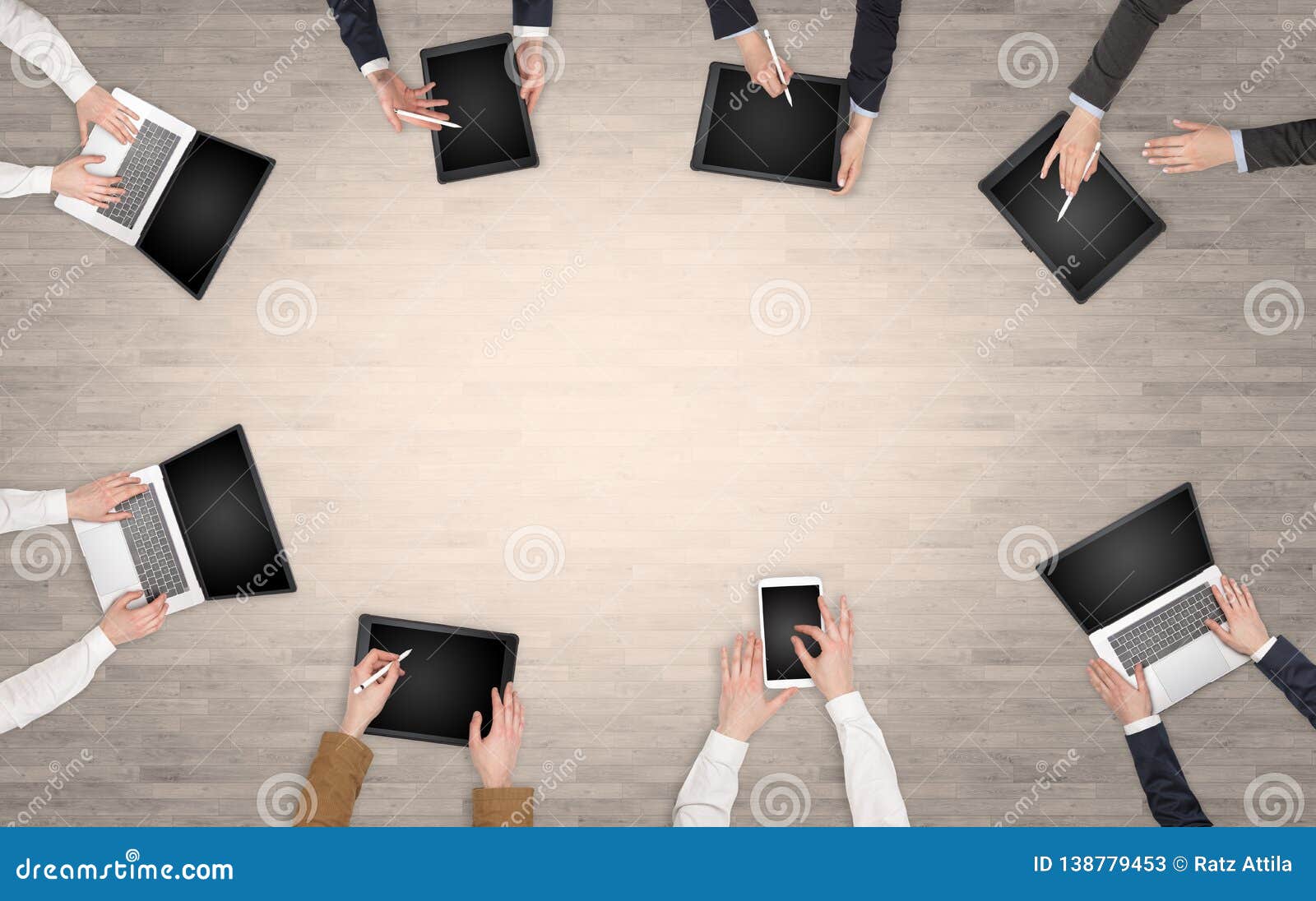 Group of People with Devices in Hands Having Desk Discussion and ...
