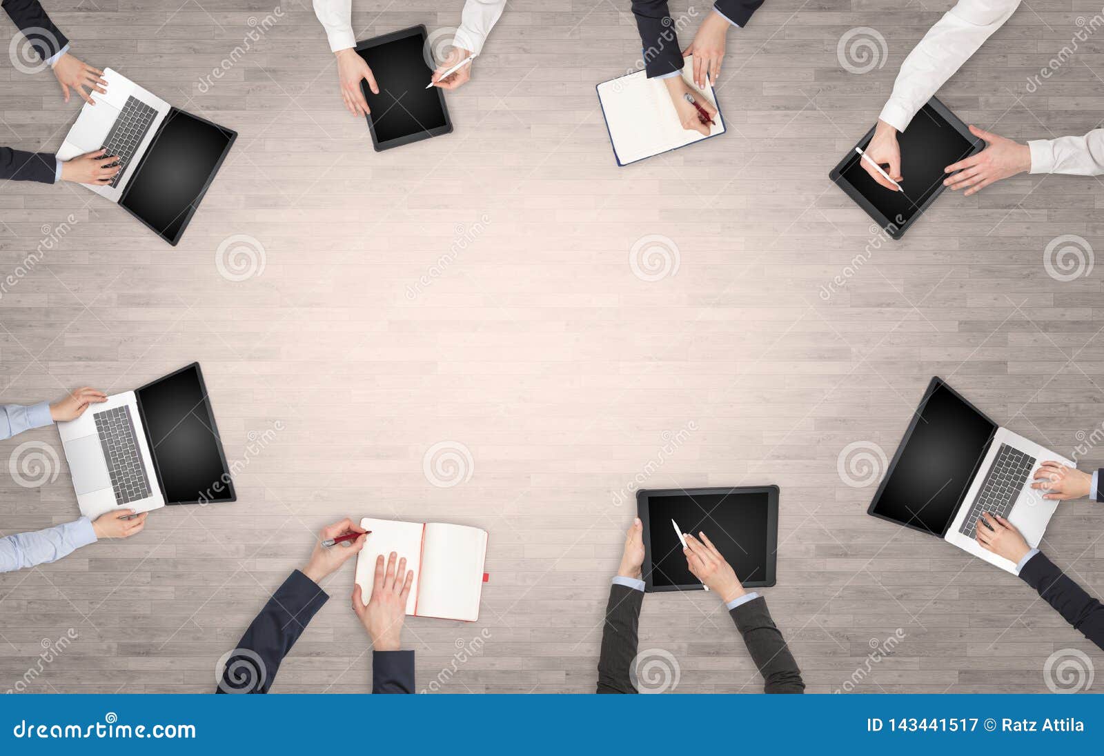 Group of People with Devices in Hands Having Desk Discussion and ...