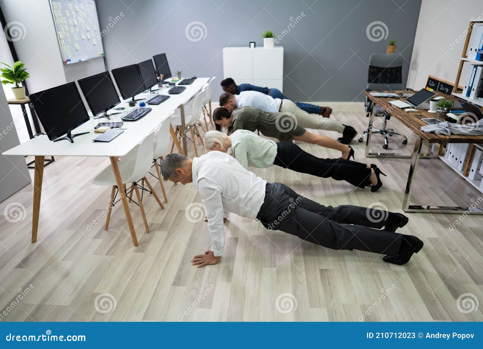 Group of People Doing Pushups at Work Stock Image - Image of stretching ...