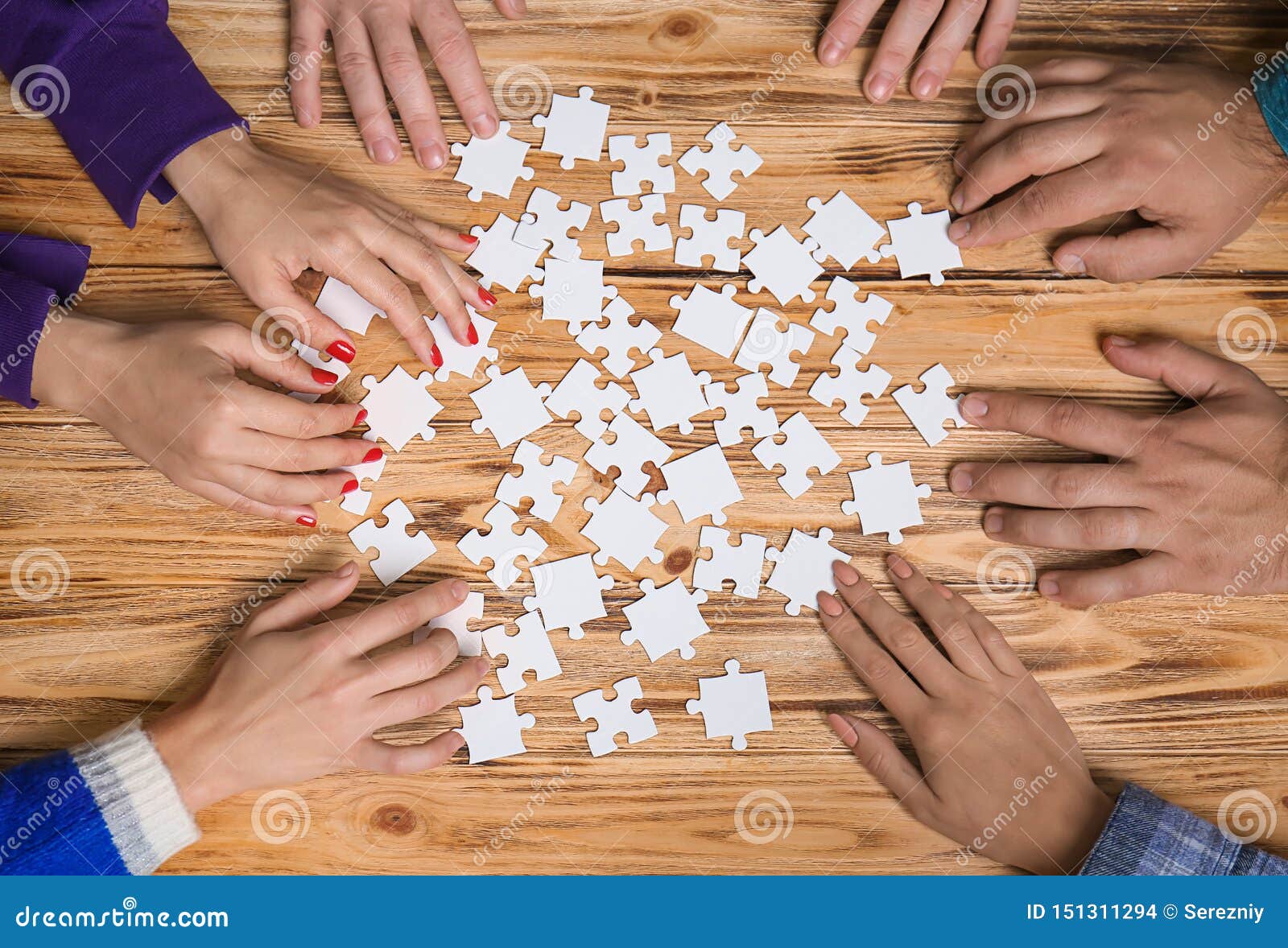 Group of People Doing Puzzle on Table Stock Photo - Image of match ...