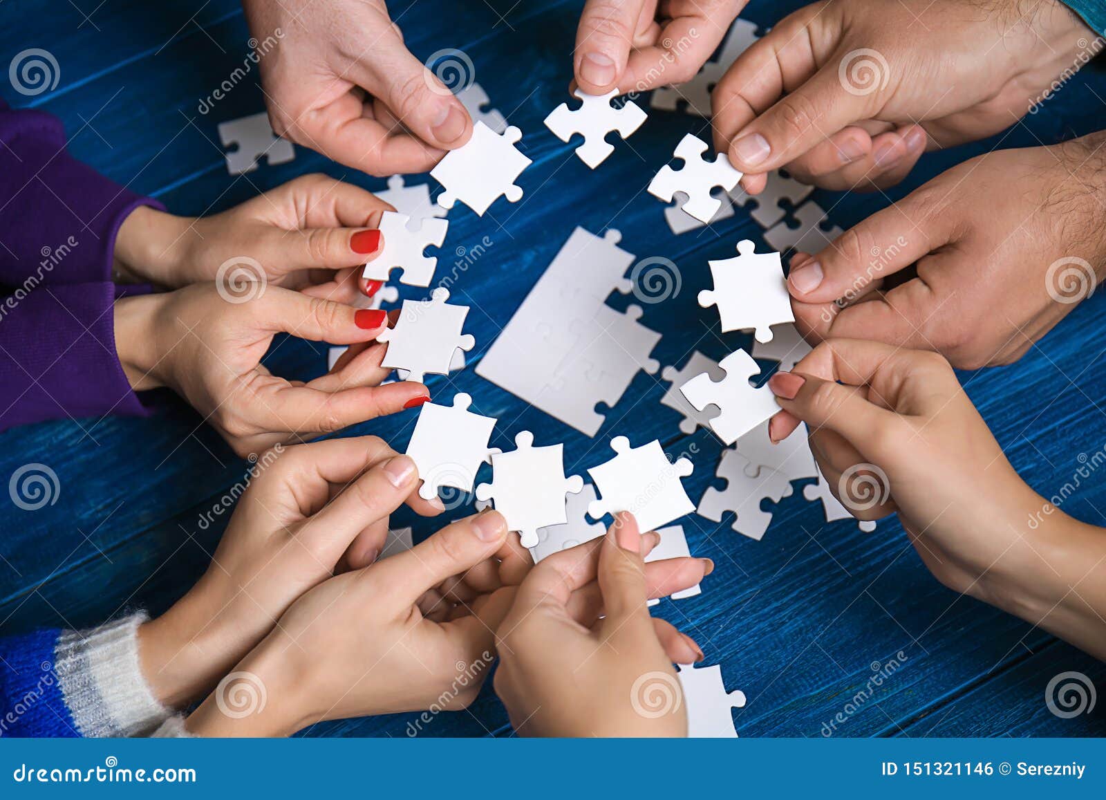 Group of People Doing Puzzle on Table Stock Photo - Image of game ...