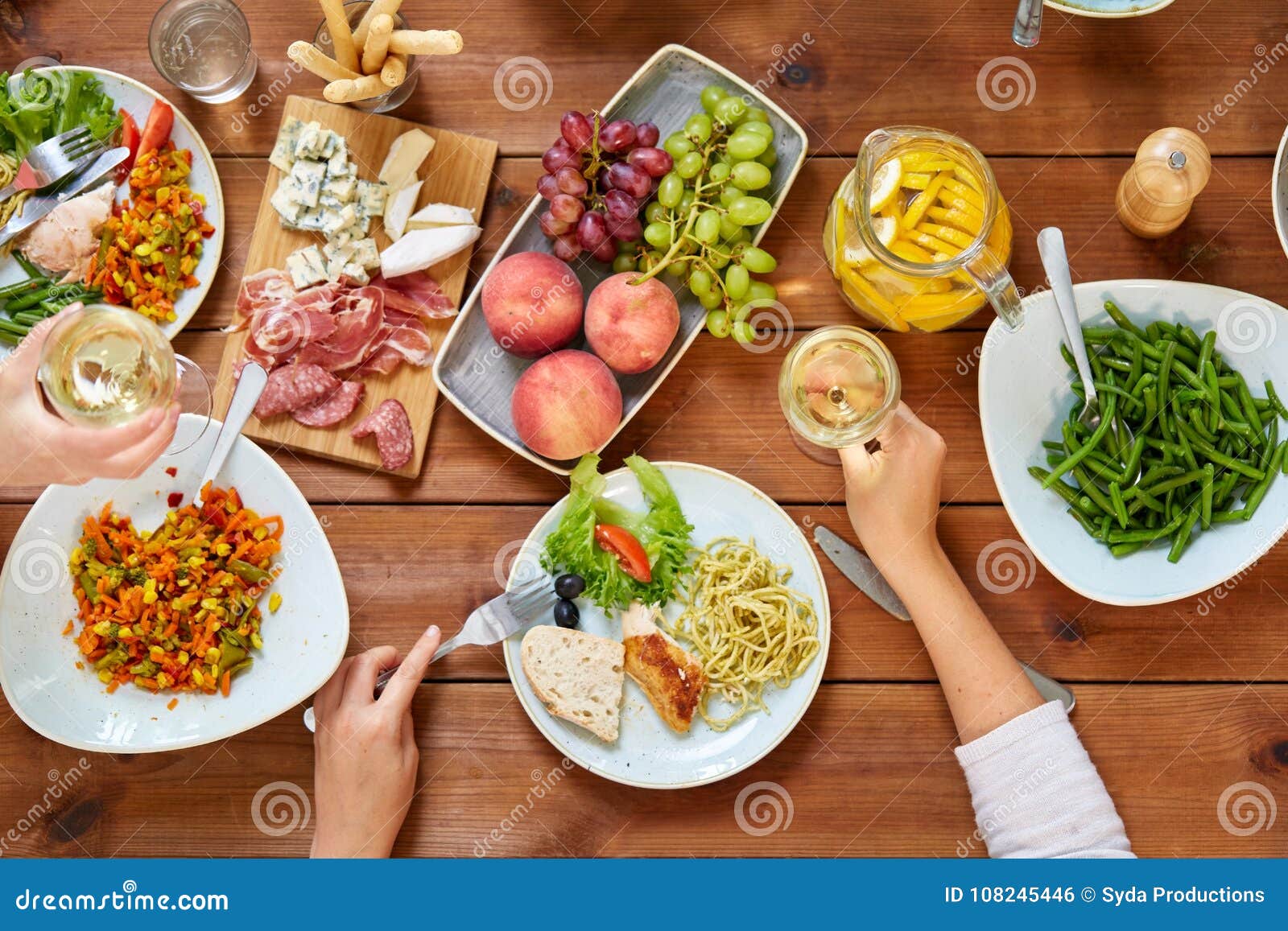 Group of People Eating at Table with Food Stock Photo - Image of ...