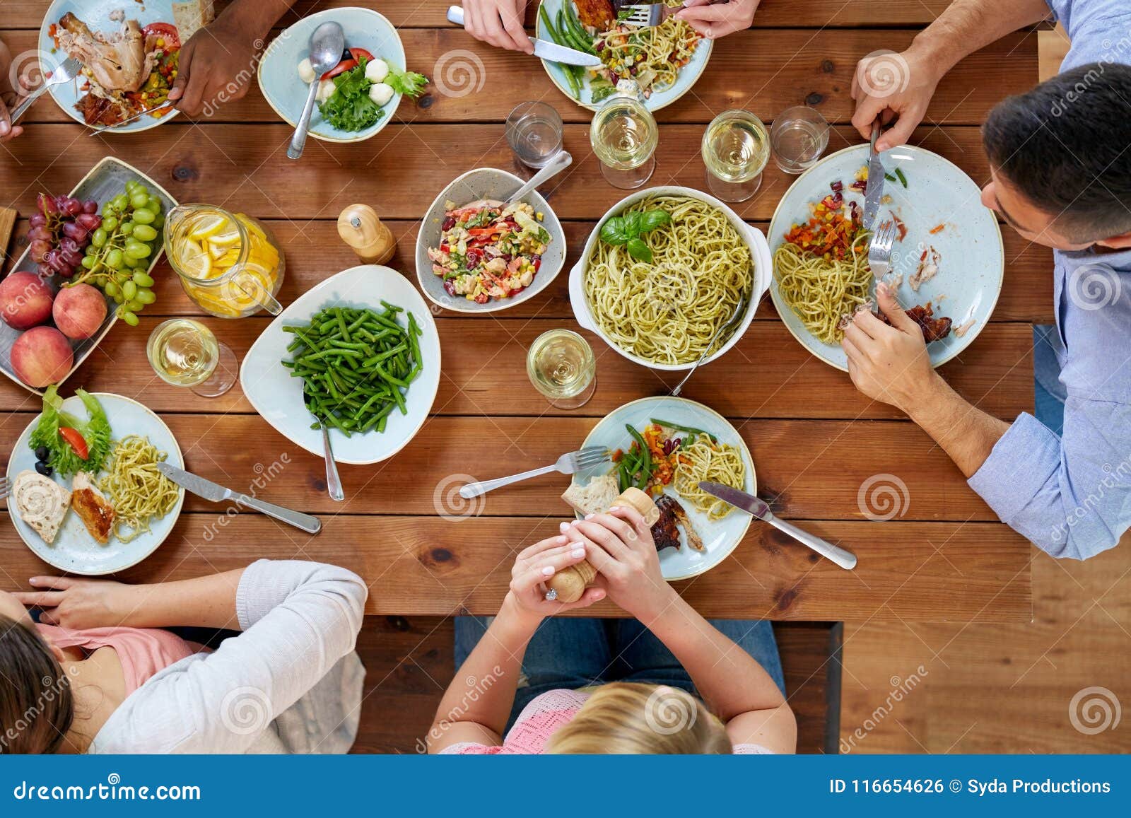 Group of People Eating at Table with Food Stock Photo - Image of ...