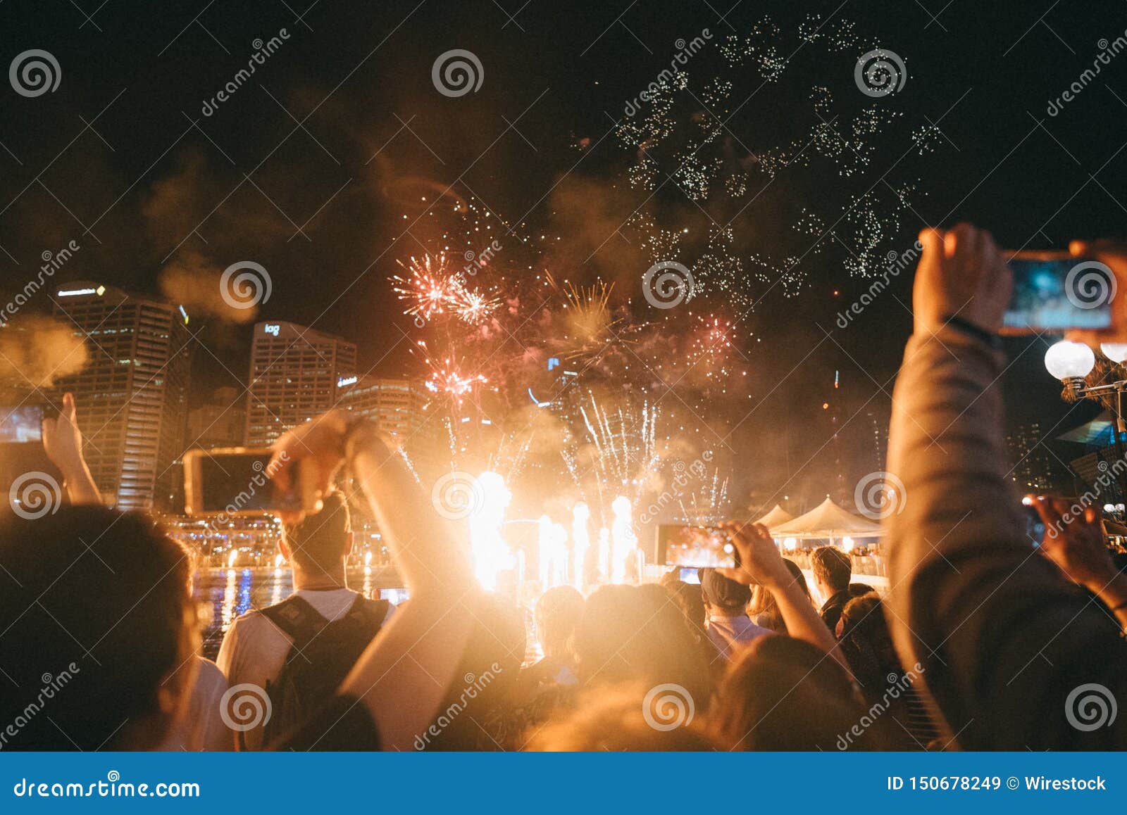 Group of People Enjoying Bright Sparking Fireworks at a Festival ...