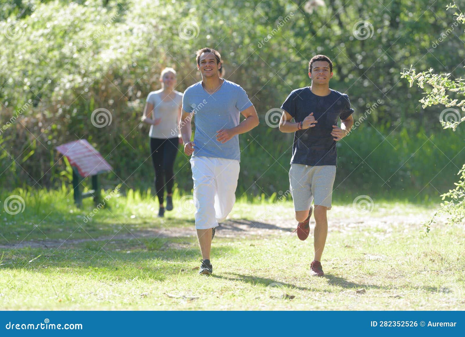 Group People Exercising Jogging through Park Together Stock Photo ...