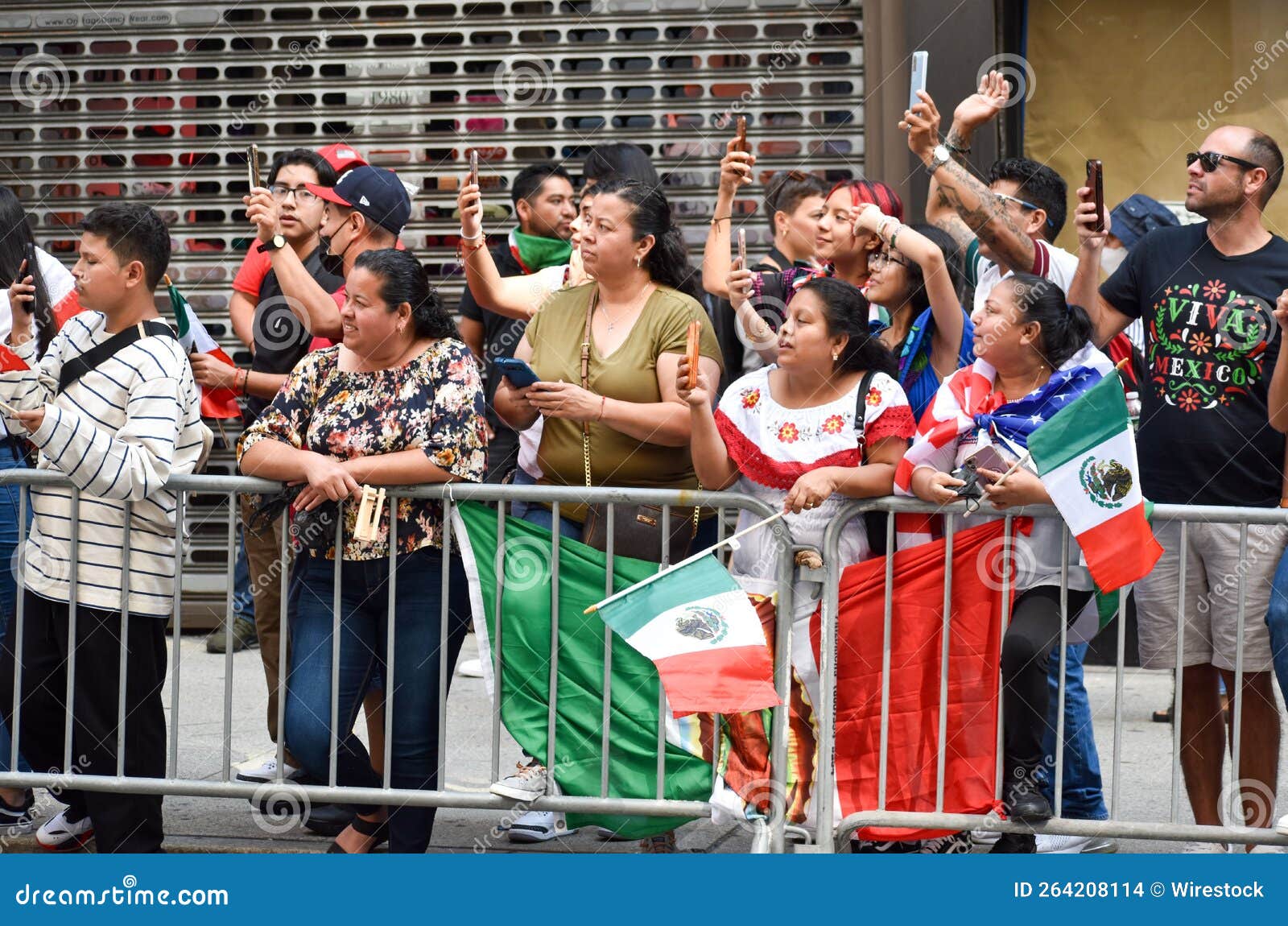 Group of People with Flag Watching a Performance during the Mexican ...