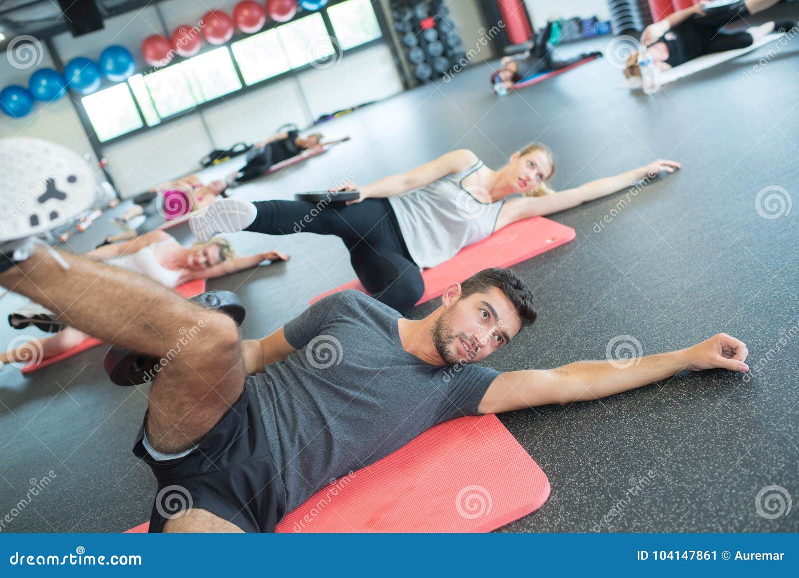 Group People on Floor Doing Leg Exercises Stock Image - Image of studio ...