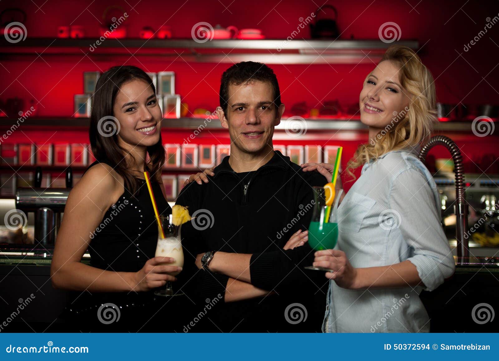 Group of People Gathering in Cocktail Bar and Having Fun Stock Photo ...