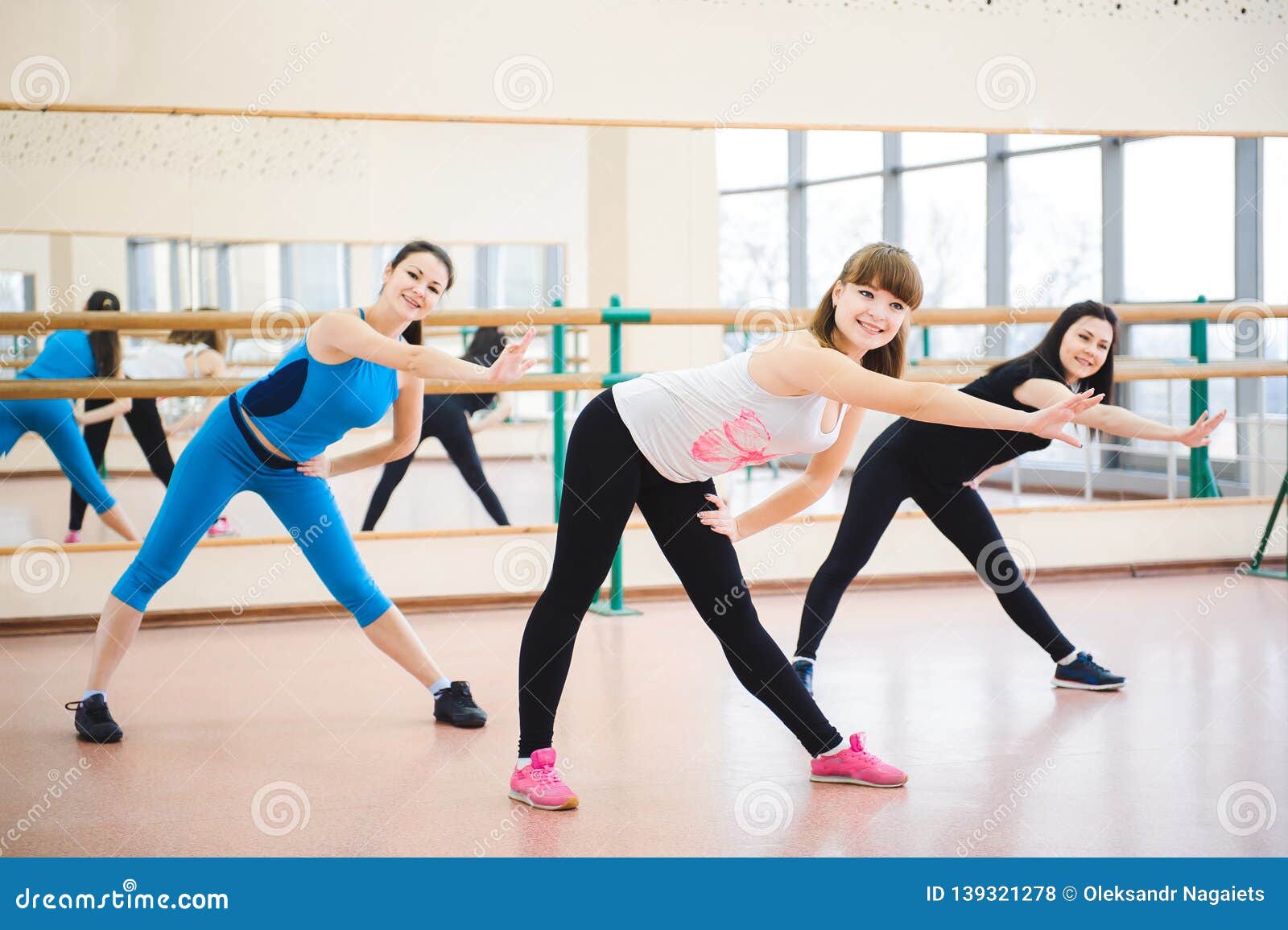 Group of People at the Gym in a Stretching Class Stock Photo - Image of ...