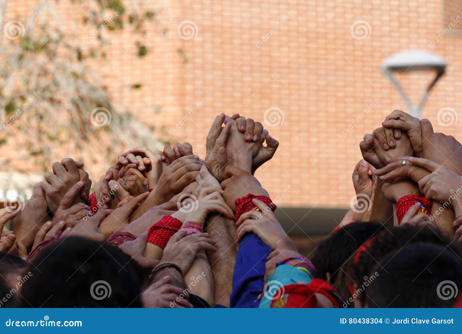 Group of People with Hands Up Together Stock Photo - Image of castells ...