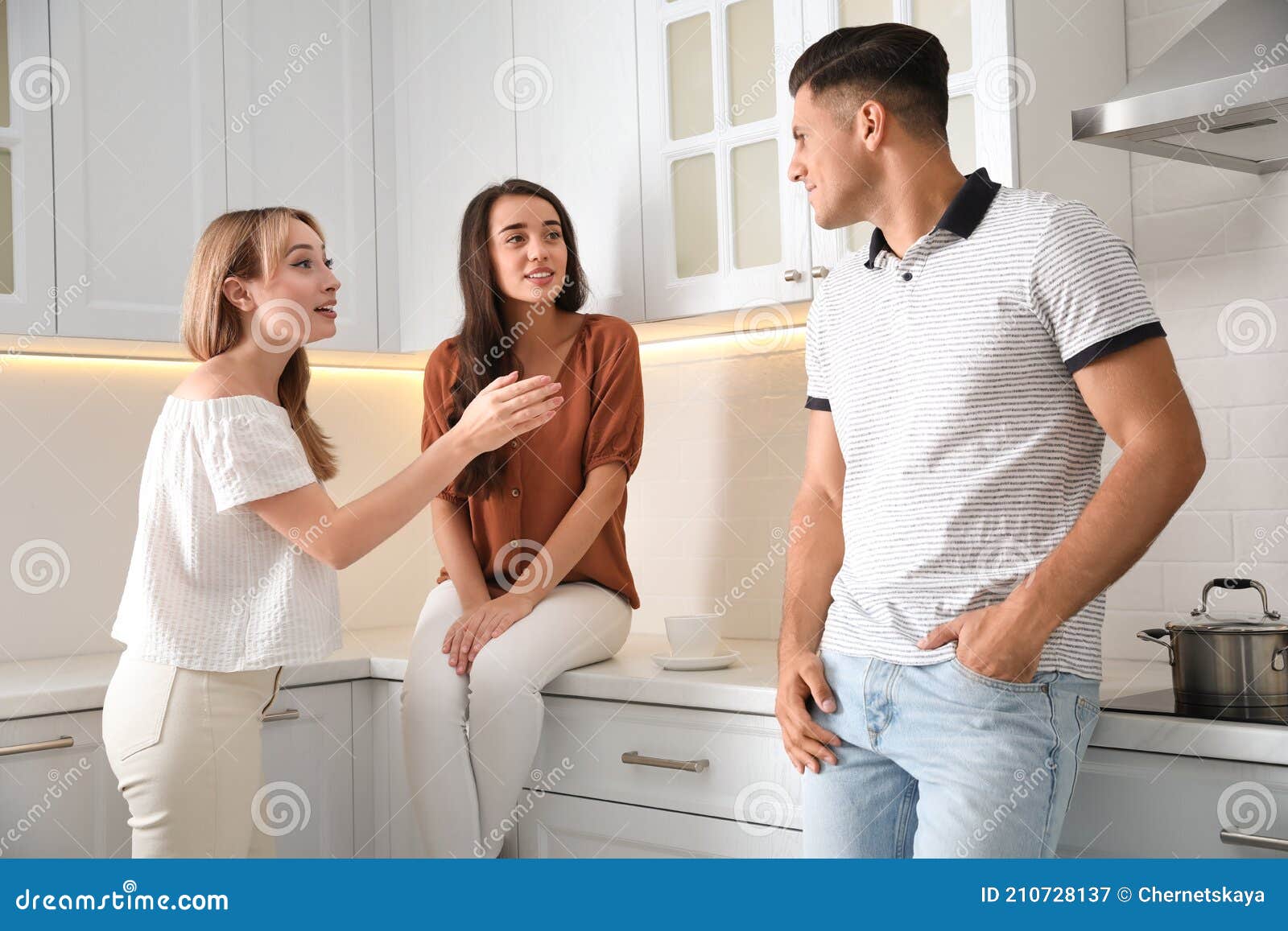 Group of People Having Conversation in Kitchen Stock Image - Image of ...
