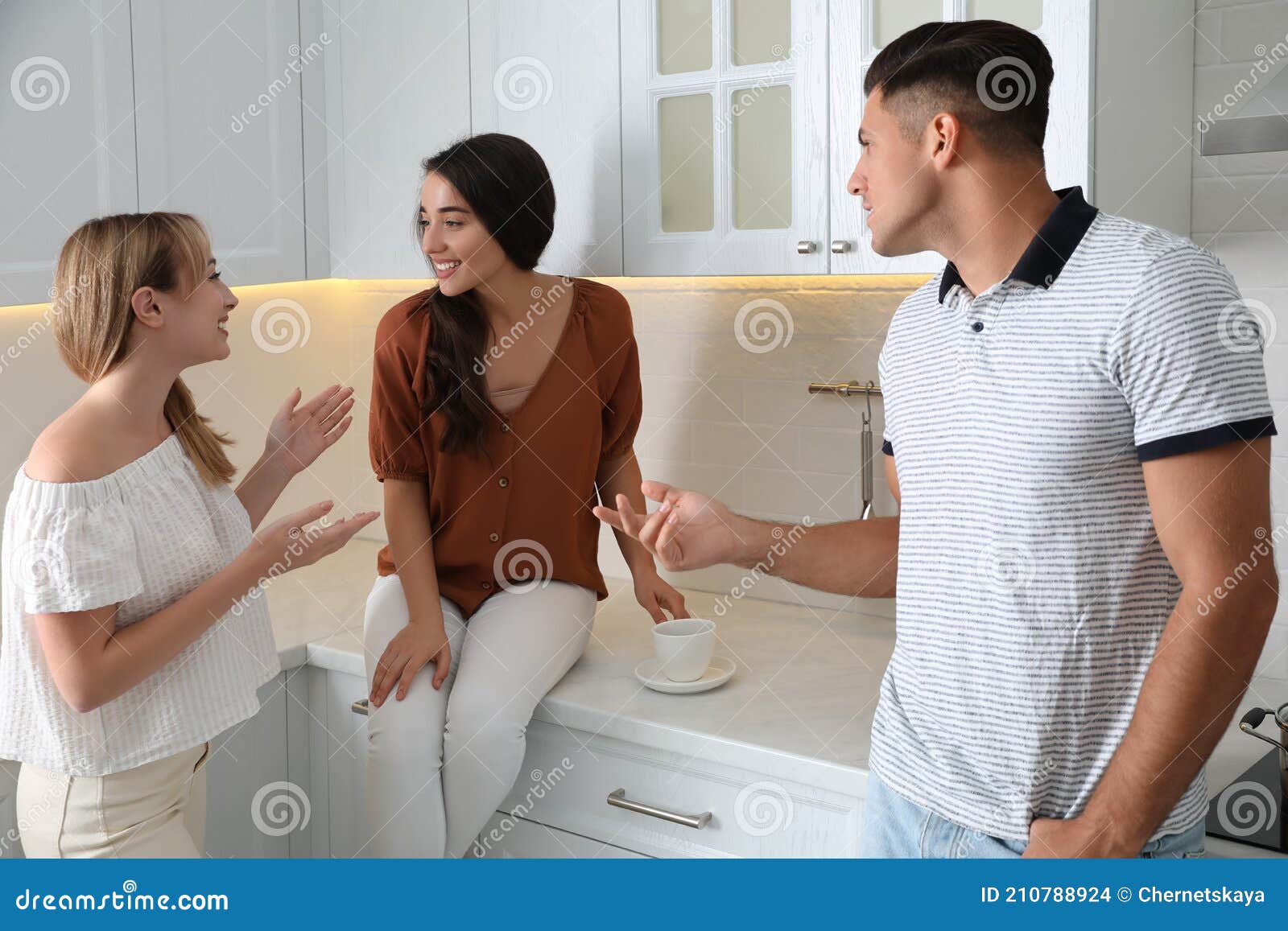 Group of People Having Conversation in Kitchen Stock Photo - Image of ...