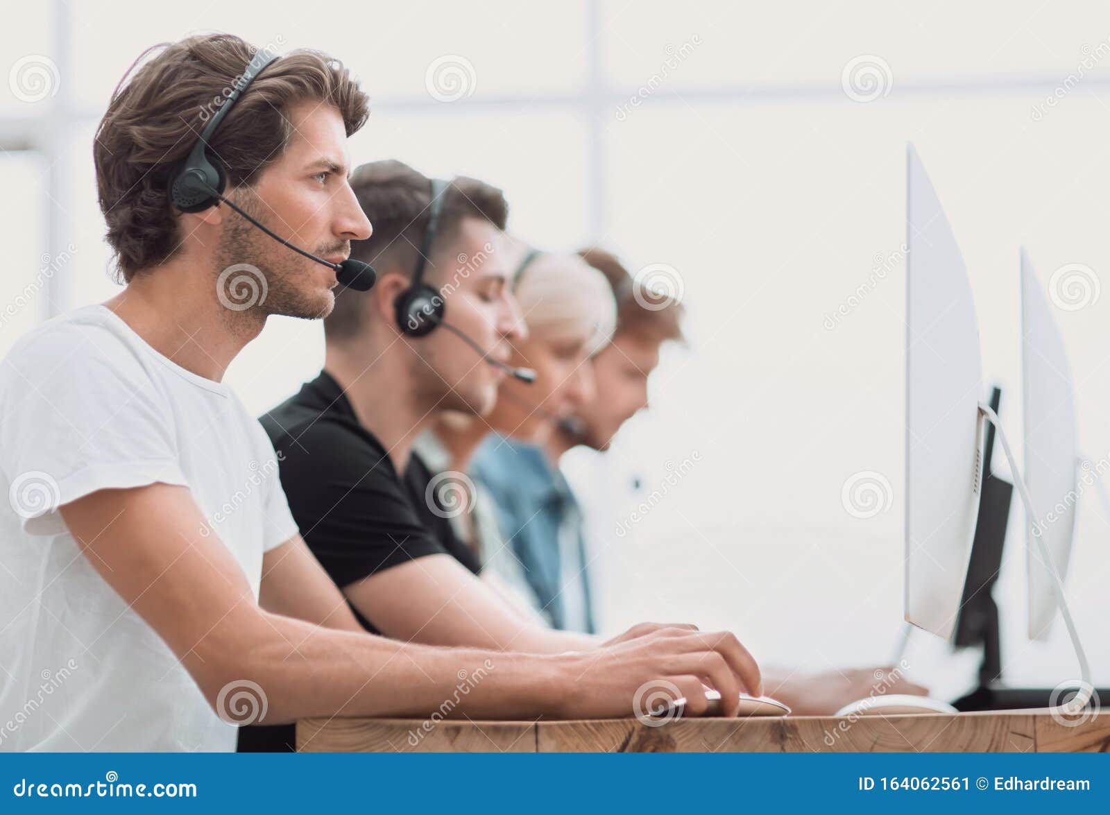 Group of People in the Headset Works on Personal Computers. Stock Image ...