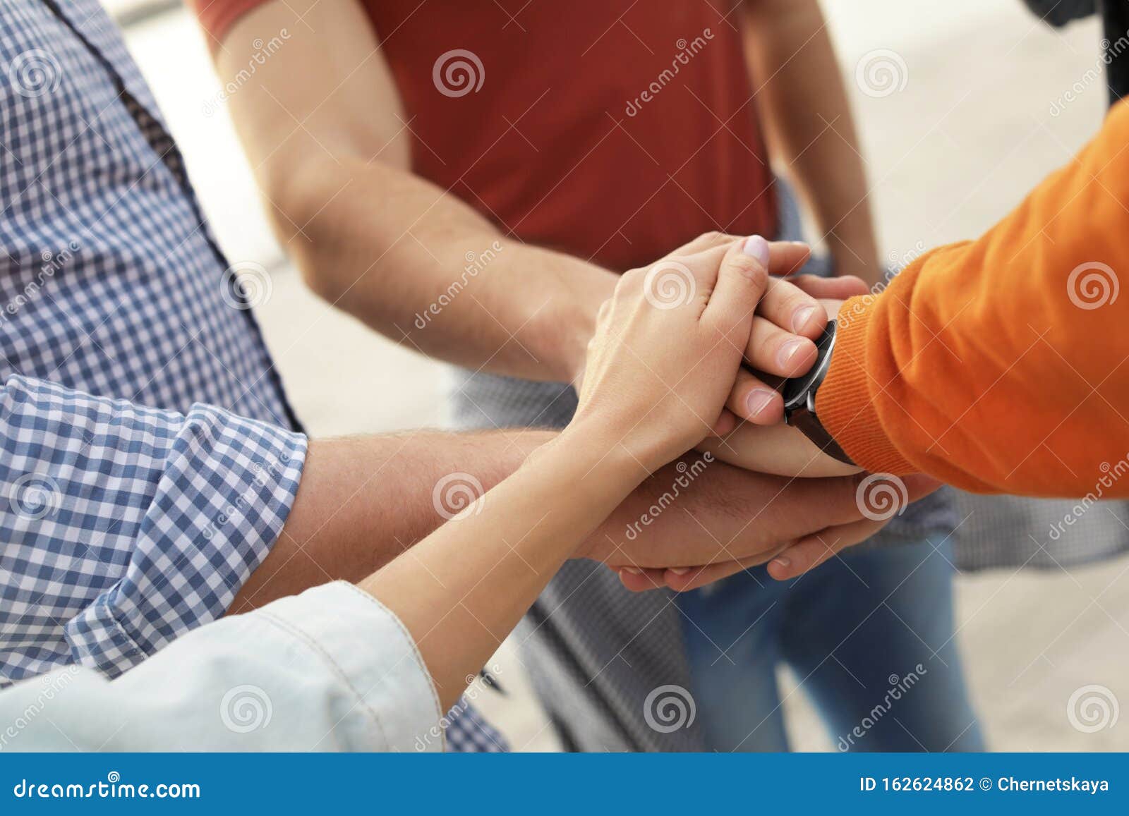Group of People Holding Hands Together Outdoors Stock Photo - Image of ...
