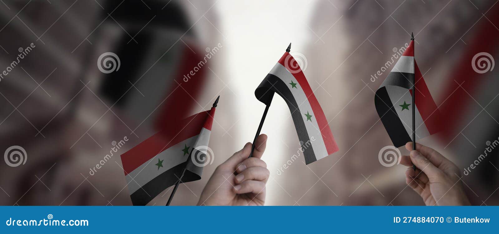 A Group of People Holding Small Flags of the Syria in Their Hands Stock ...
