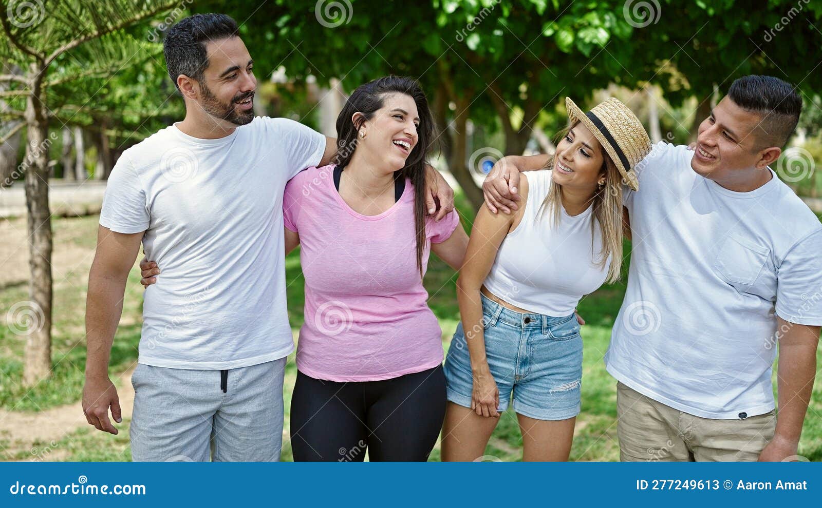 Group of People Hugging Each Other Smiling at Park Stock Image - Image ...