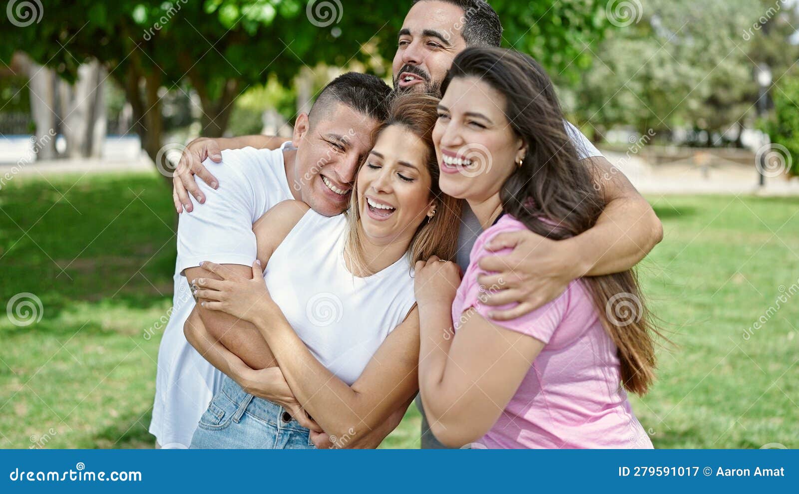 Group of People Hugging Each Other Smiling at Park Stock Image - Image ...