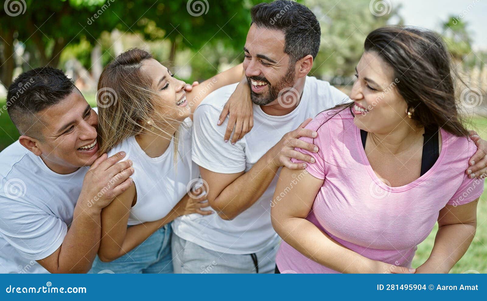 Group of People Hugging Each Other Smiling at Park Stock Photo - Image ...