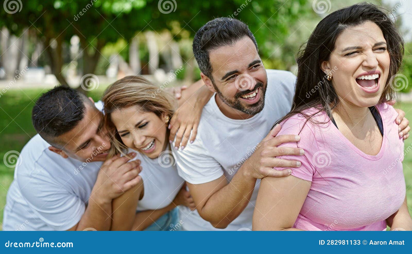 Group of People Hugging Each Other Smiling at Park Stock Image - Image ...