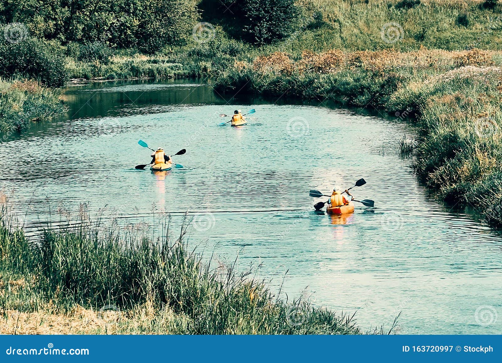 A Group of People are Kayaking on the River. Partying and Camping Stock ...