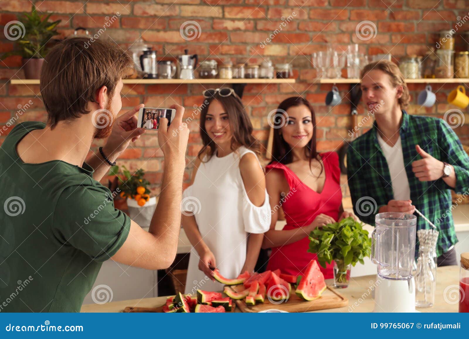 People at kitchen stock image. Image of group, phone - 99765067