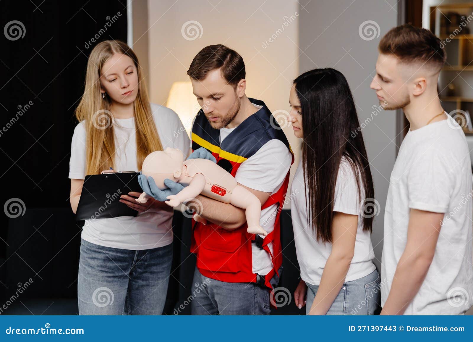 Group of People Learning How To Make First Aid with Dummy Child during ...