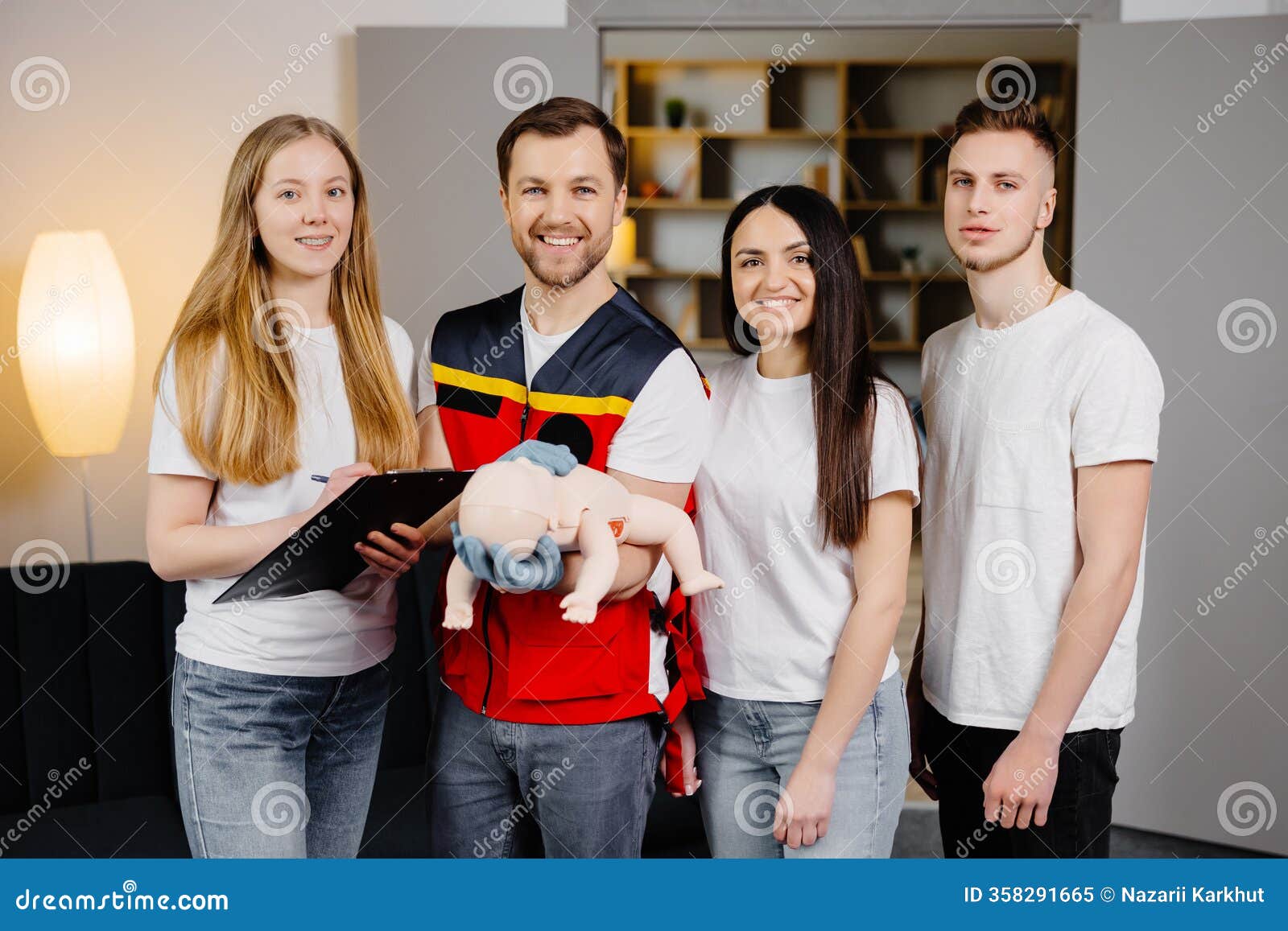 Group of People Learning How To Make First Aid with Dummy Child during ...