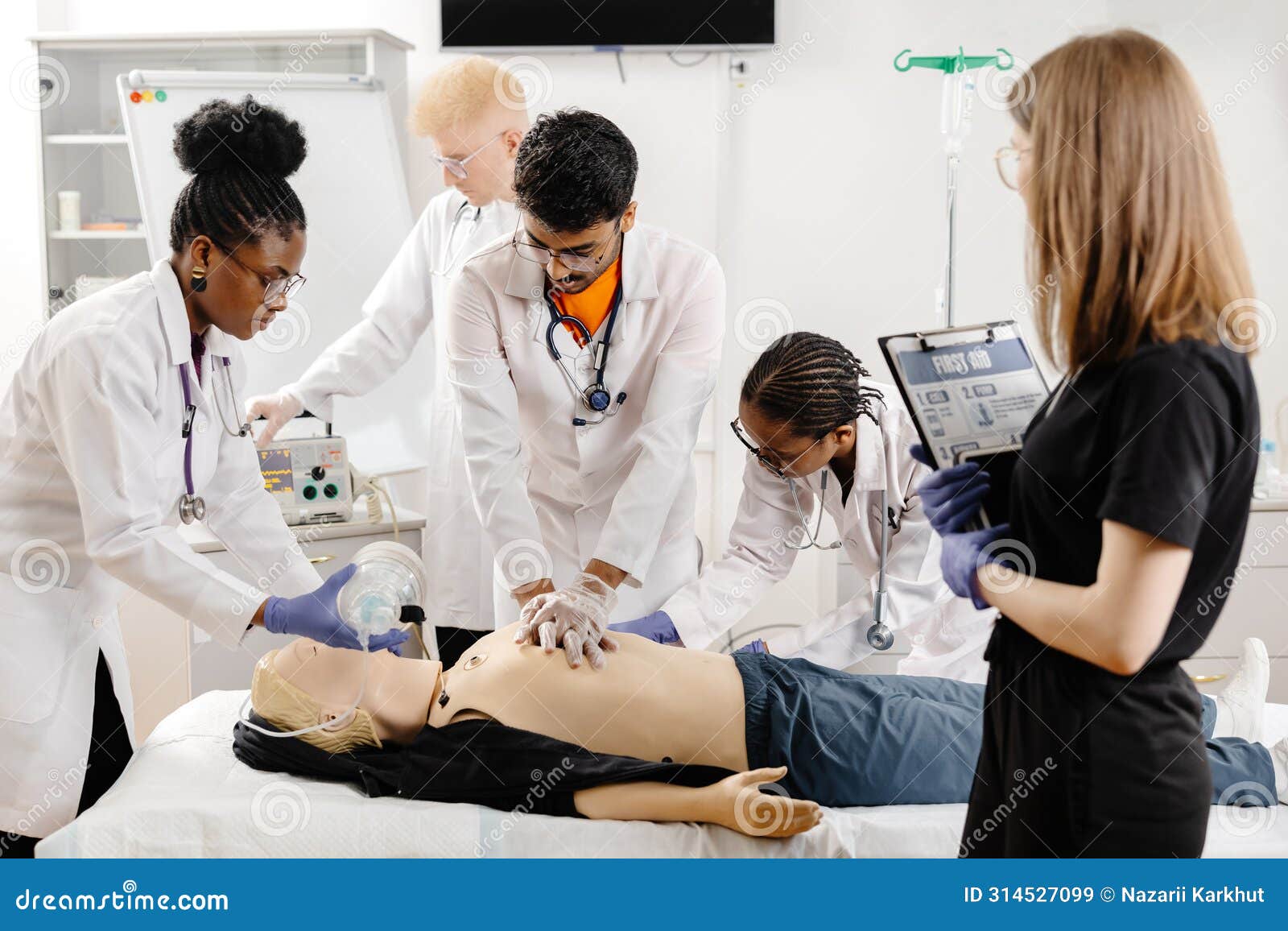 Group of People Learning How To Make First Aid Heart Compressions with ...