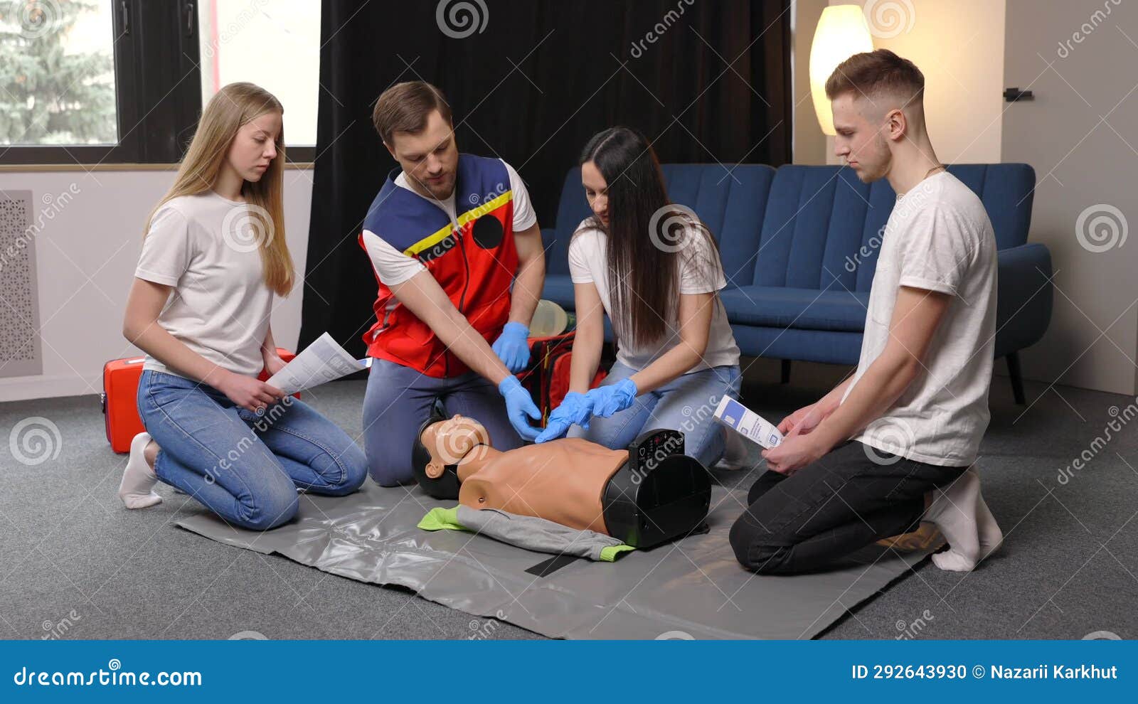 Group of People Learning How To Make First Aid Heart Compressions with ...
