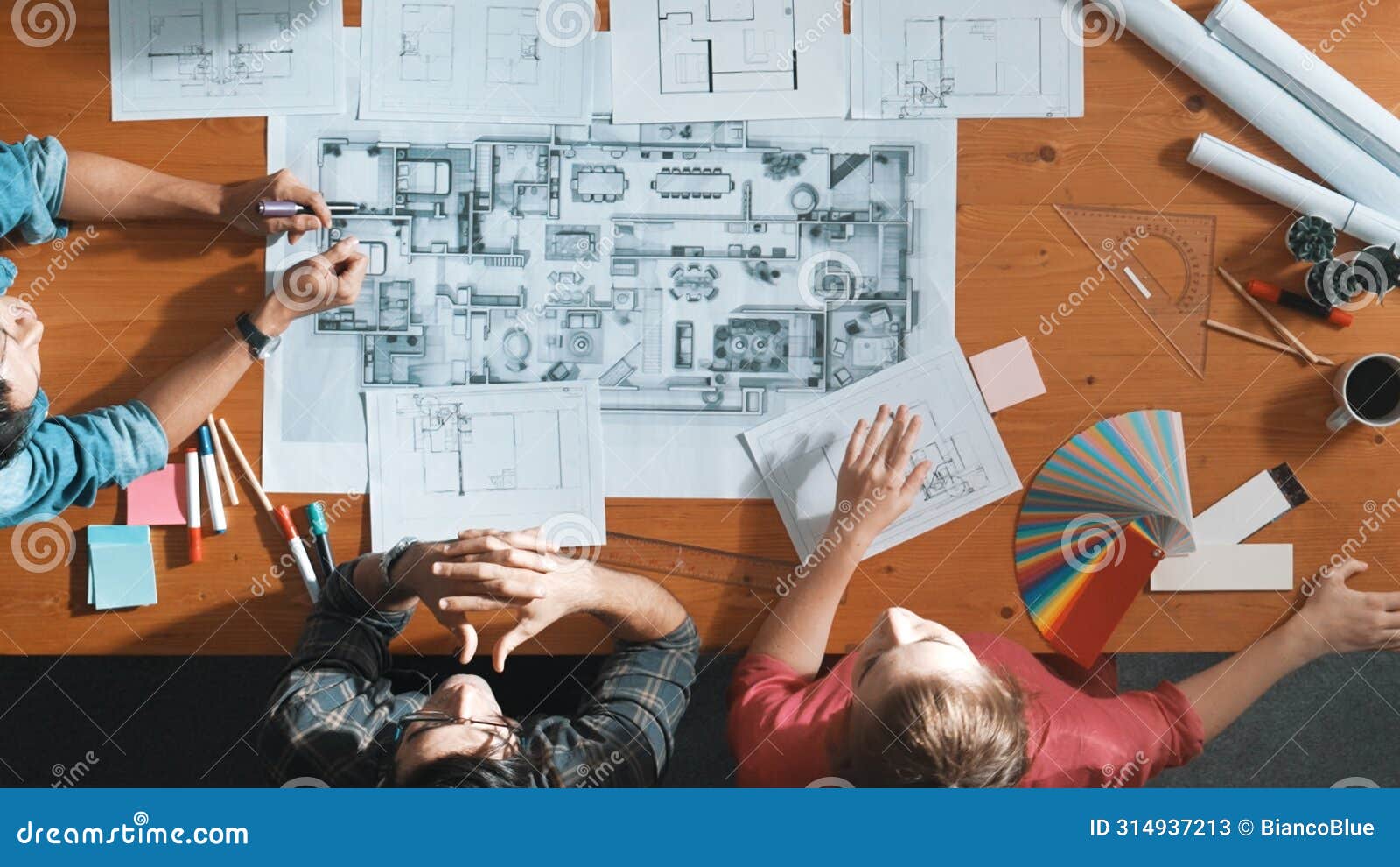 Group of Diverse Team Looking at Blueprint while Brainstorming Idea ...