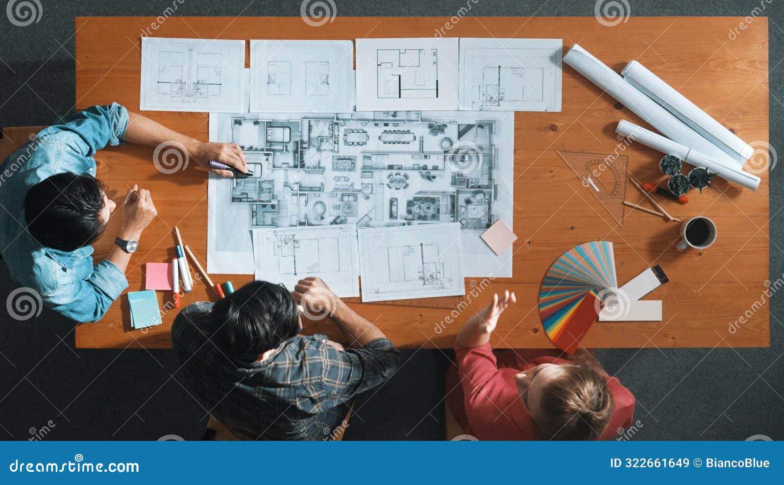 Group of Diverse Team Looking at Blueprint while Brainstorming Idea ...