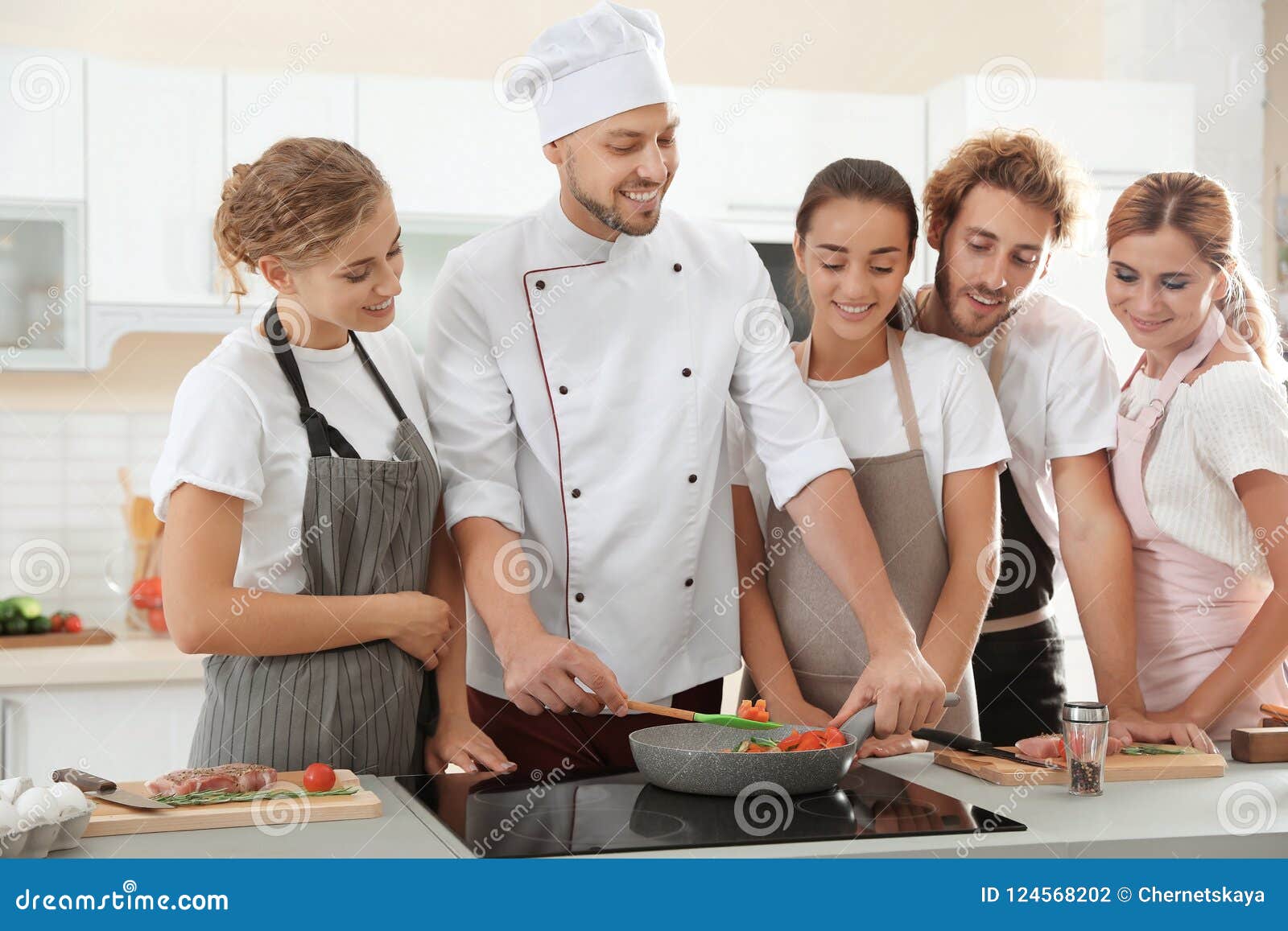 Group of People and Male Chef Stock Photo - Image of aprons, chef ...