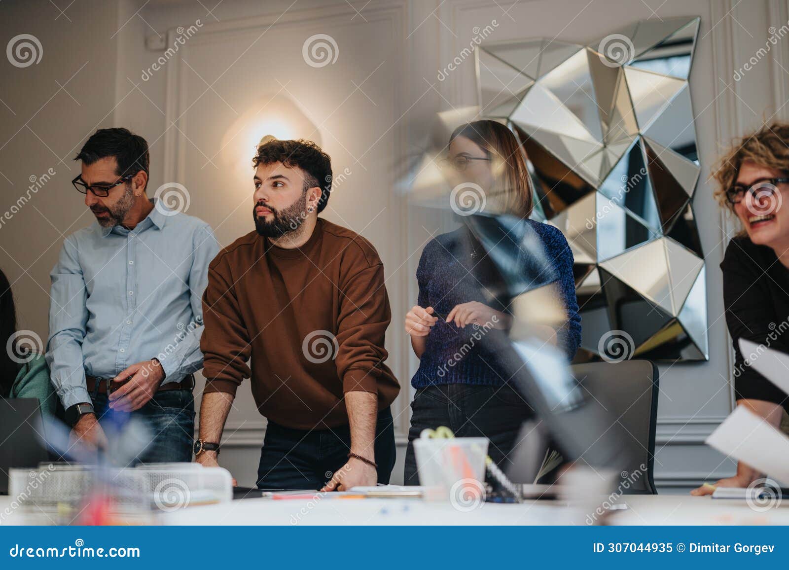 A Group of People Participates in a Dynamic Discussion in an Elegantly ...