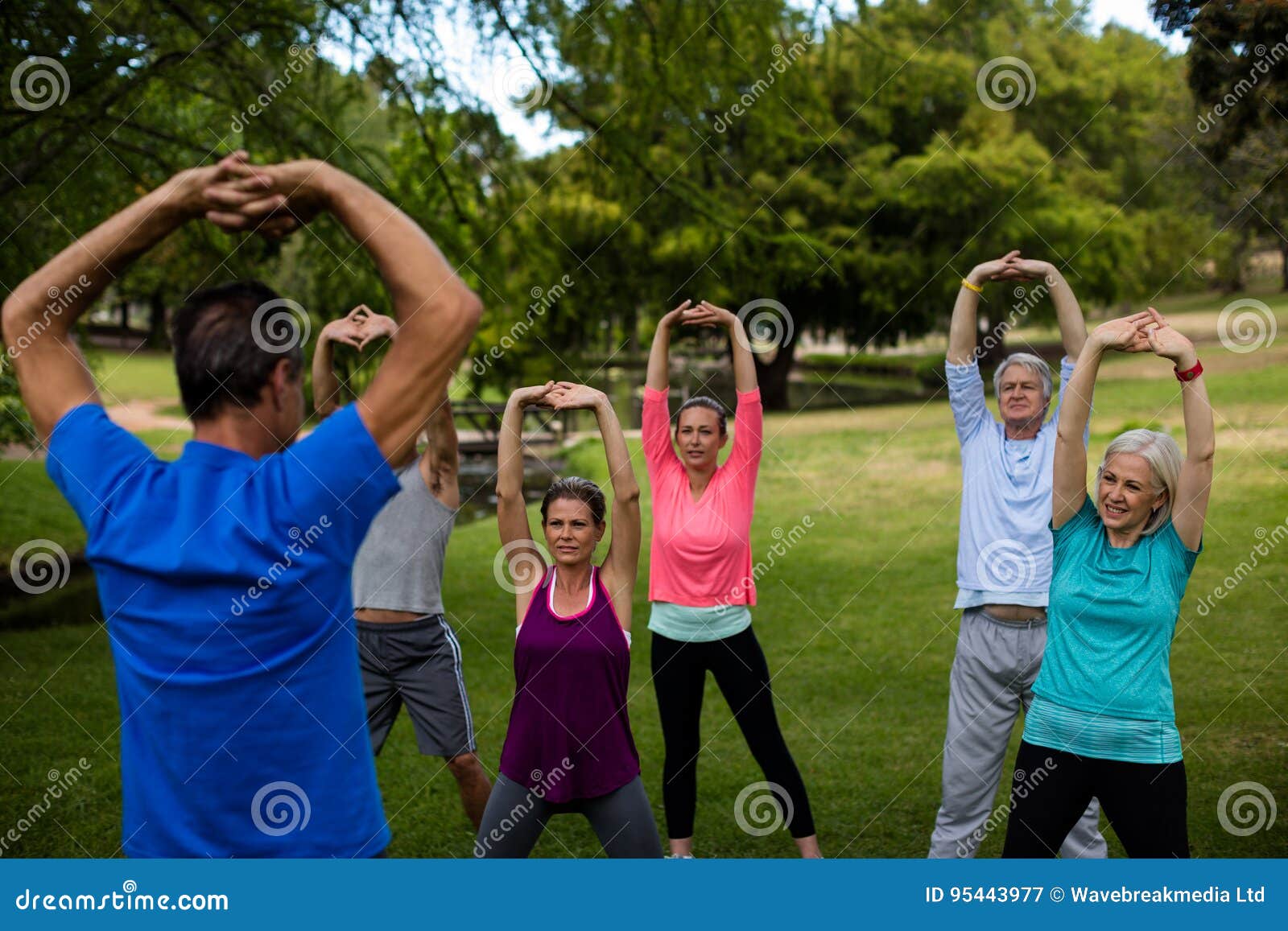 Group of People Performing Stretching Exercise Stock Image - Image of ...