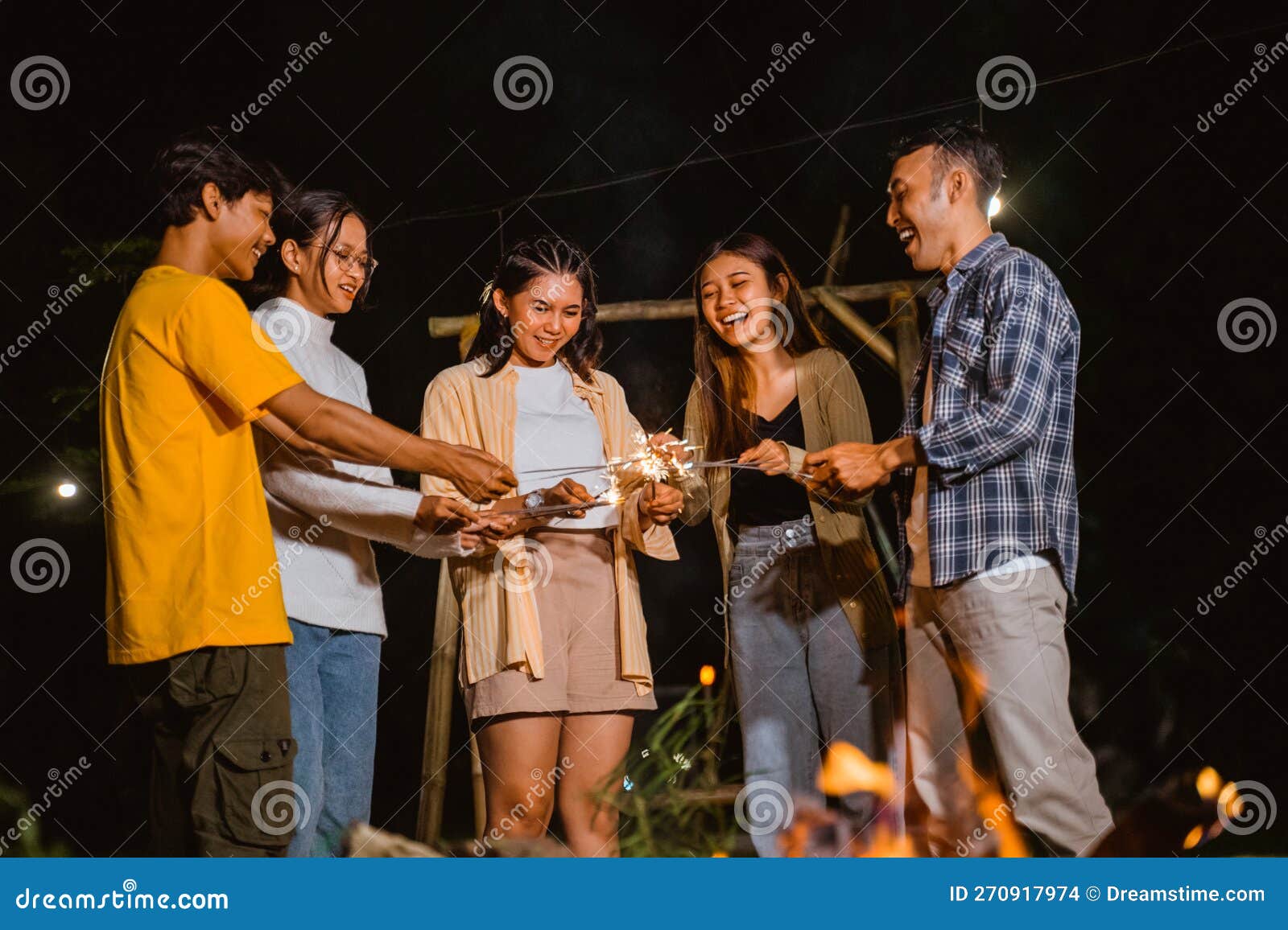A Group of People Playing with the Fireworks at the Night Stock Photo ...