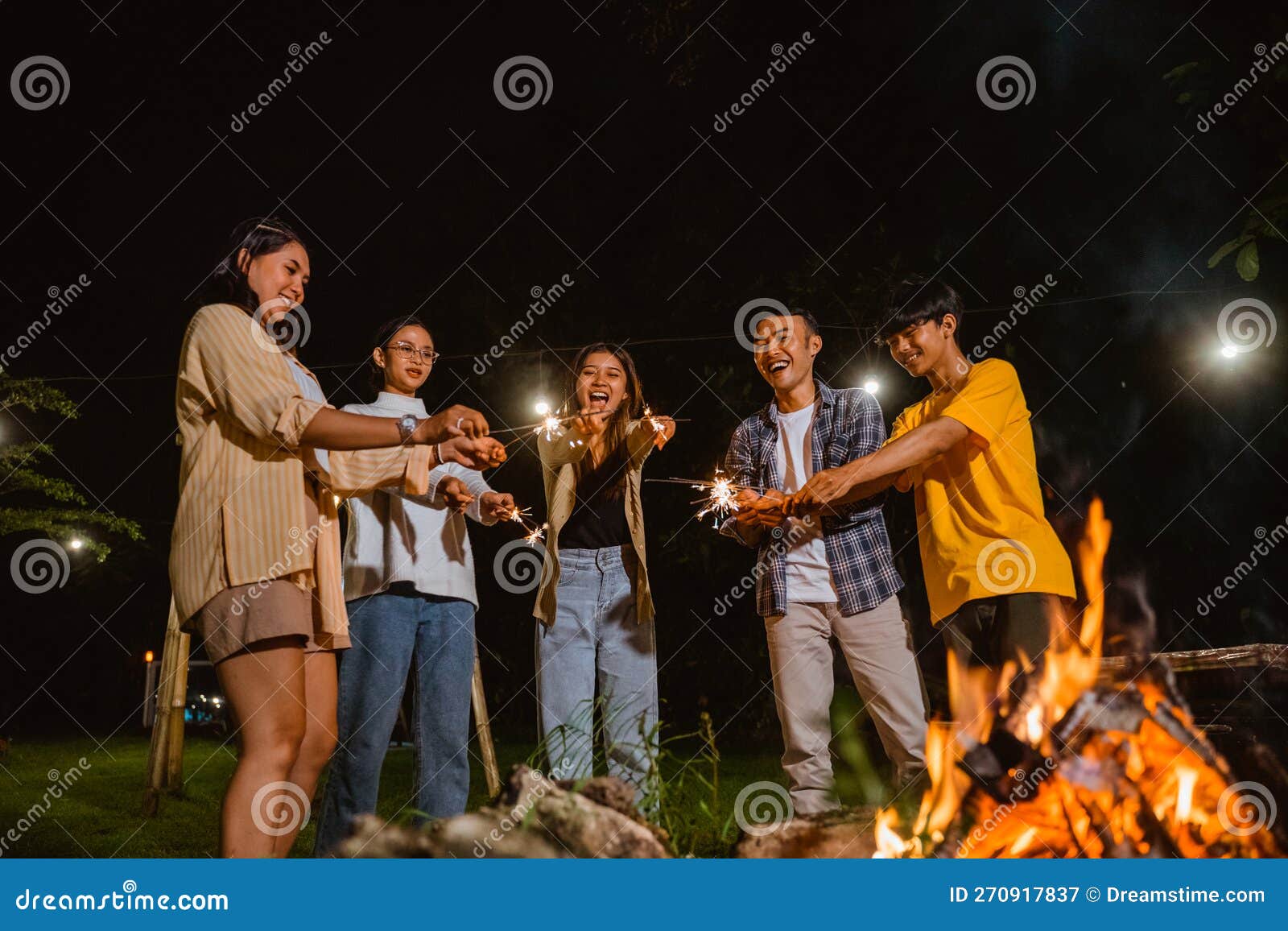 A Group of People Playing with the Fireworks and Put Its Together Stock ...