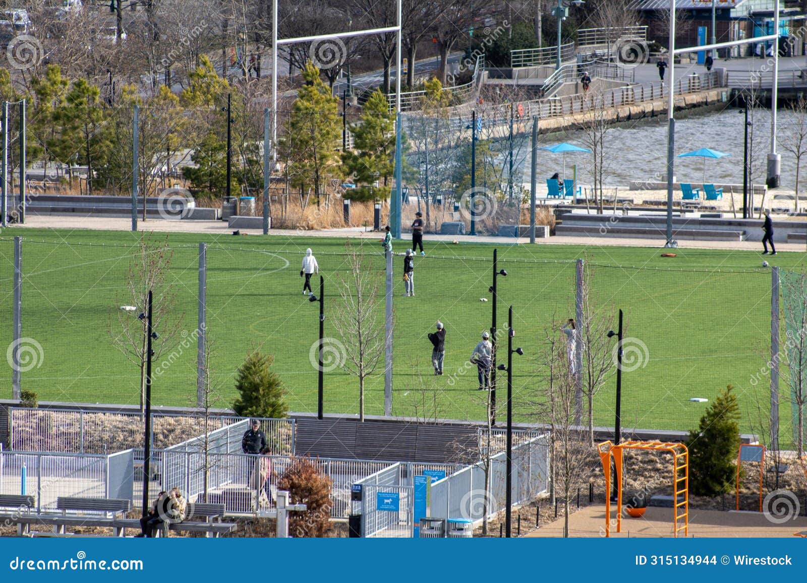 Group of People Playing on a Soccer Field Editorial Stock Image - Image ...