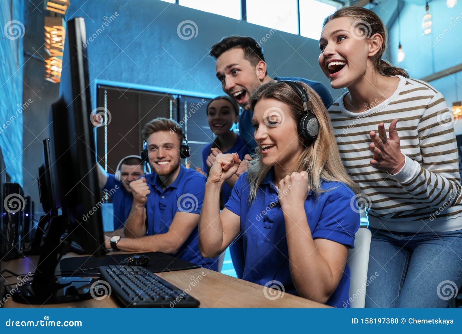 Group of People Playing Video Games in Cafe Stock Photo - Image of ...