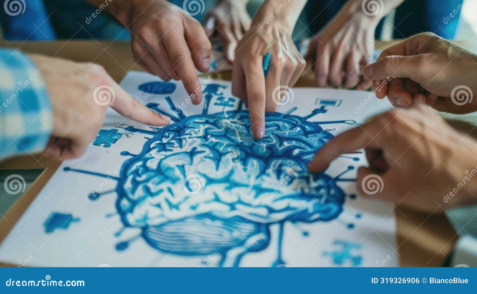 A Group of People Pointing at a Painted Brain on a Table AIG535 Stock ...