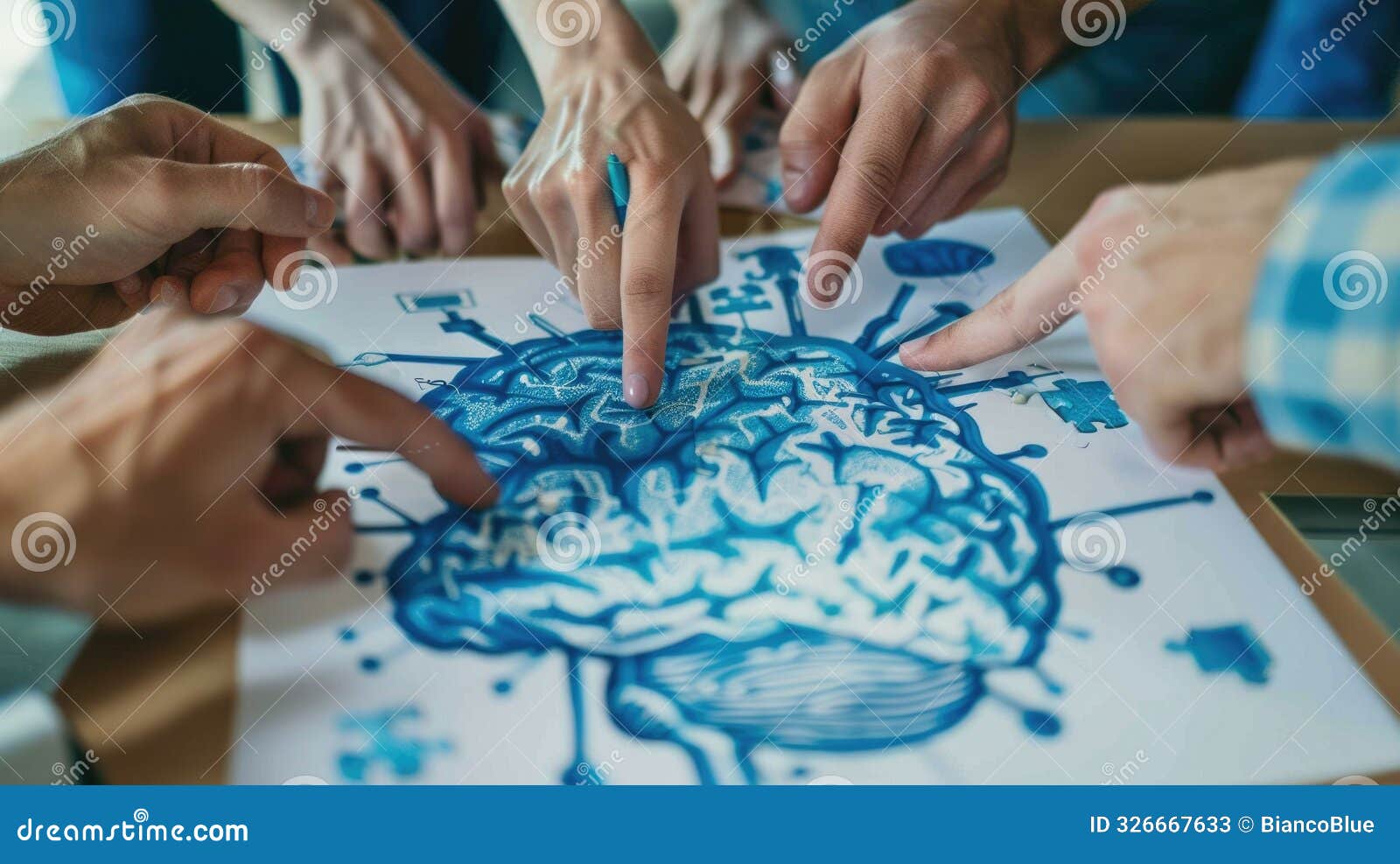 A Group of People Pointing at a Painted Brain on a Table AIG535 Stock ...