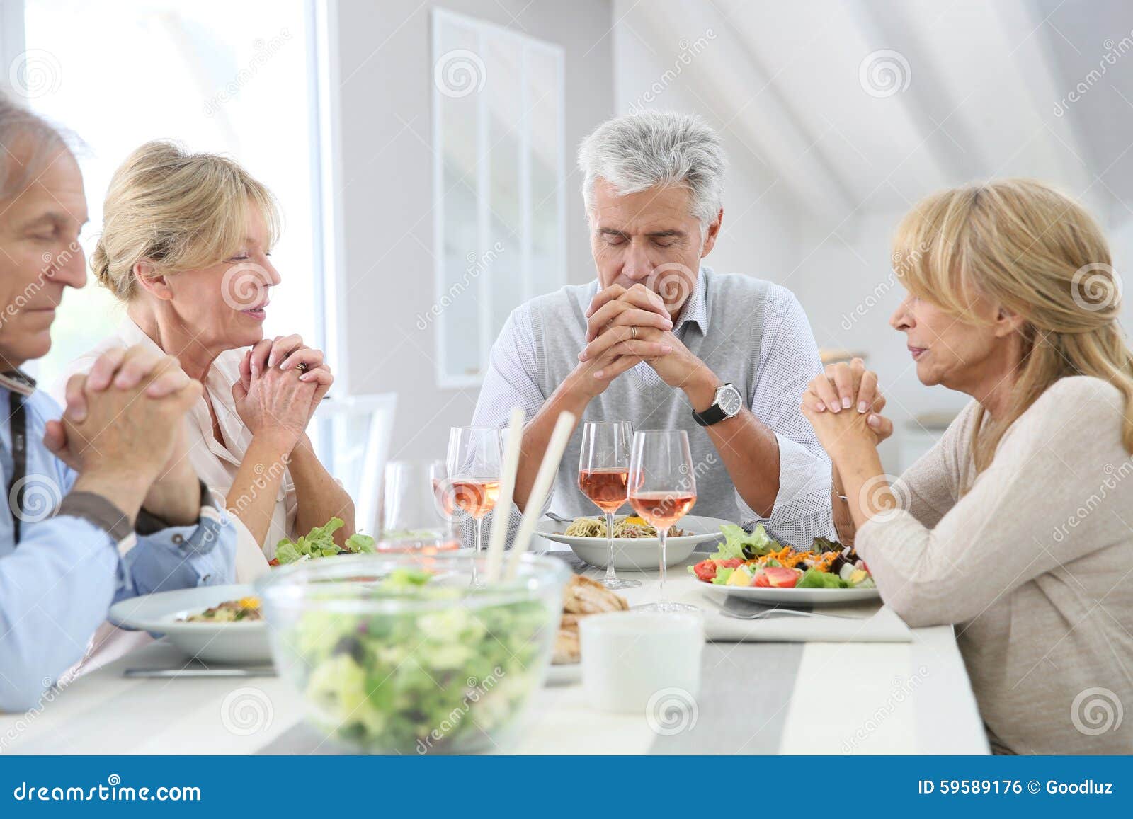 Group of People Praying before Dinner Stock Photo - Image of lunch ...