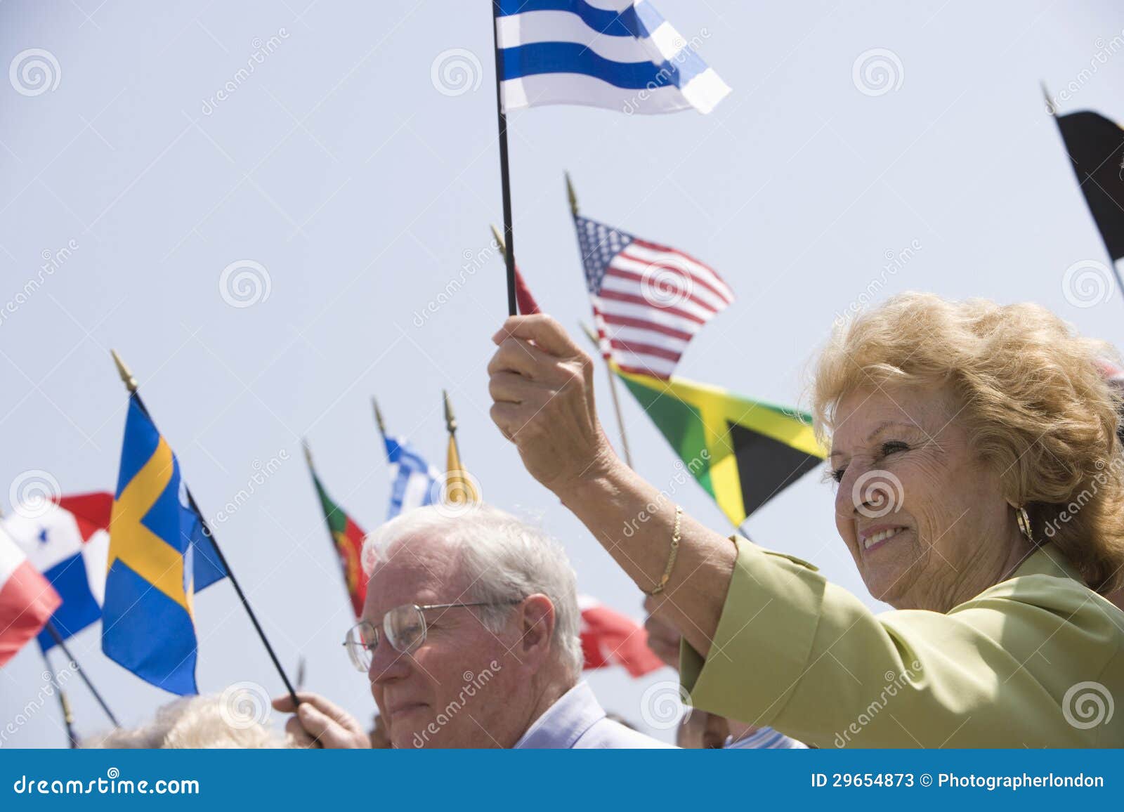 Group of People Raising Flags of Countries Stock Image - Image of ...