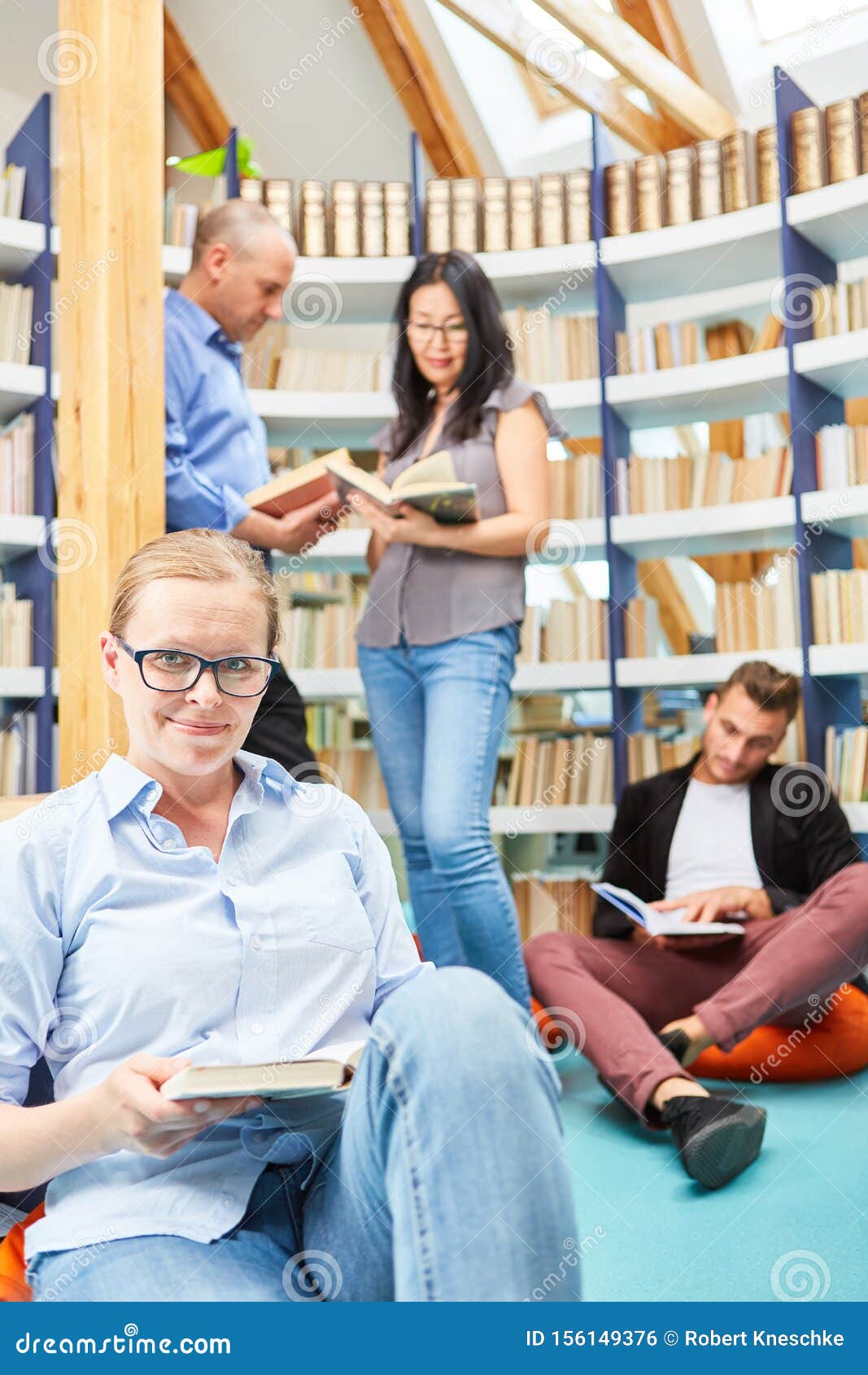 Group of People while Reading Book in the Library Stock Photo - Image ...