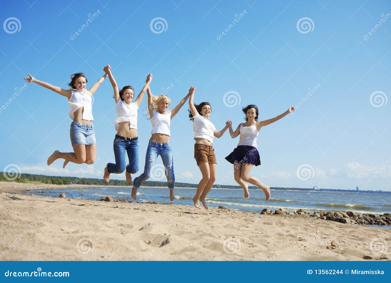 People Relaxing At The Beach