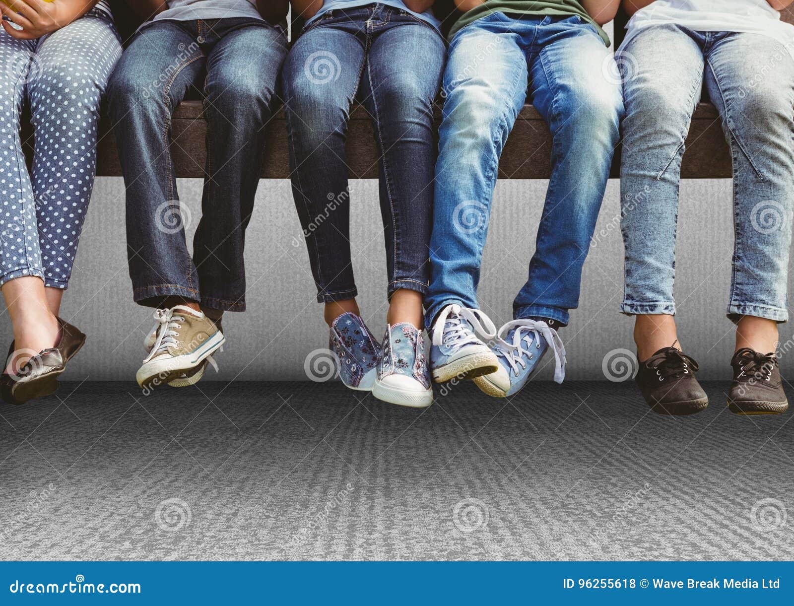 Group of People S Legs Sitting on Bench in Front of Grey Background ...