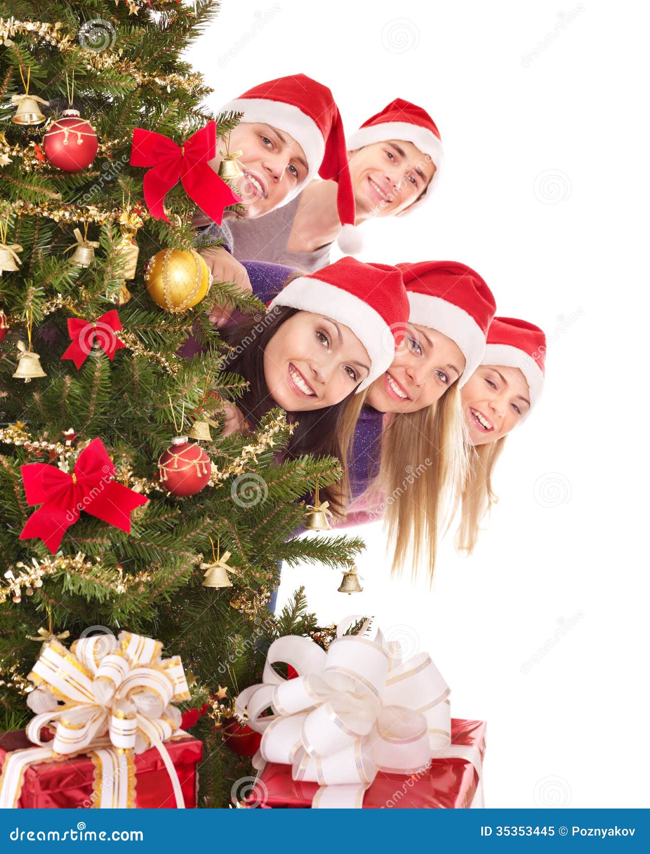 Group People in Santa Hat by Christmas Tree. Stock Image - Image of ...