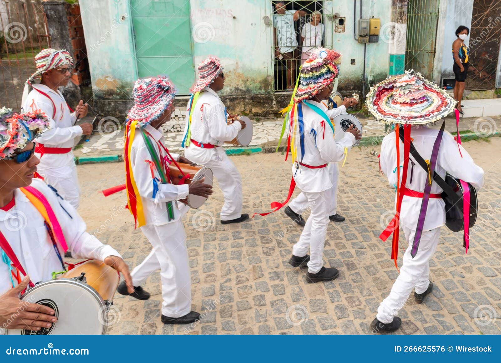 Group of People Singing and Dancing during a Parade on the Streets of ...